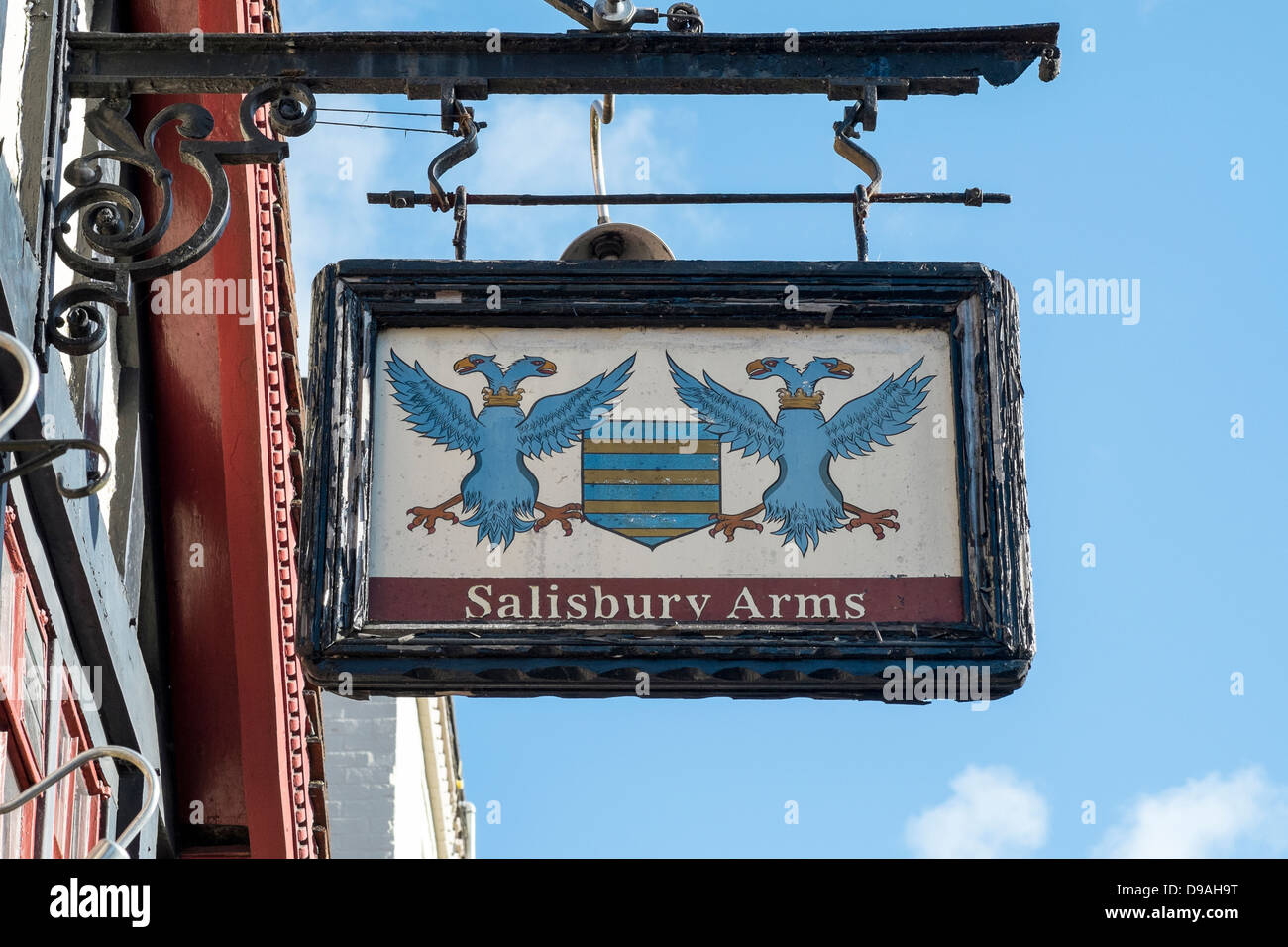 Looking up at old painted pub sign with peeling paint for the Salisbury ...