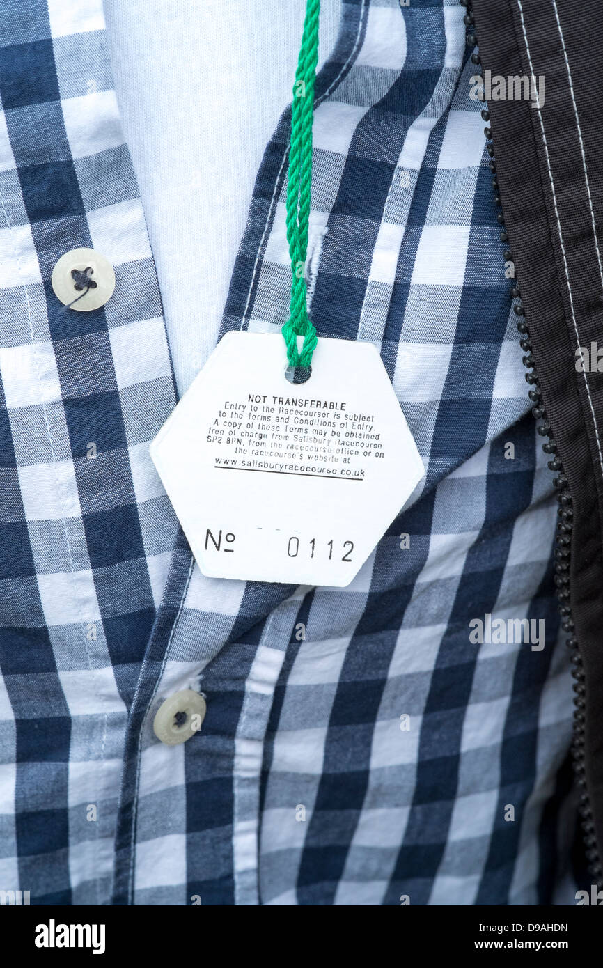 reverse side of horse racing track pass badge showing the terms and ...