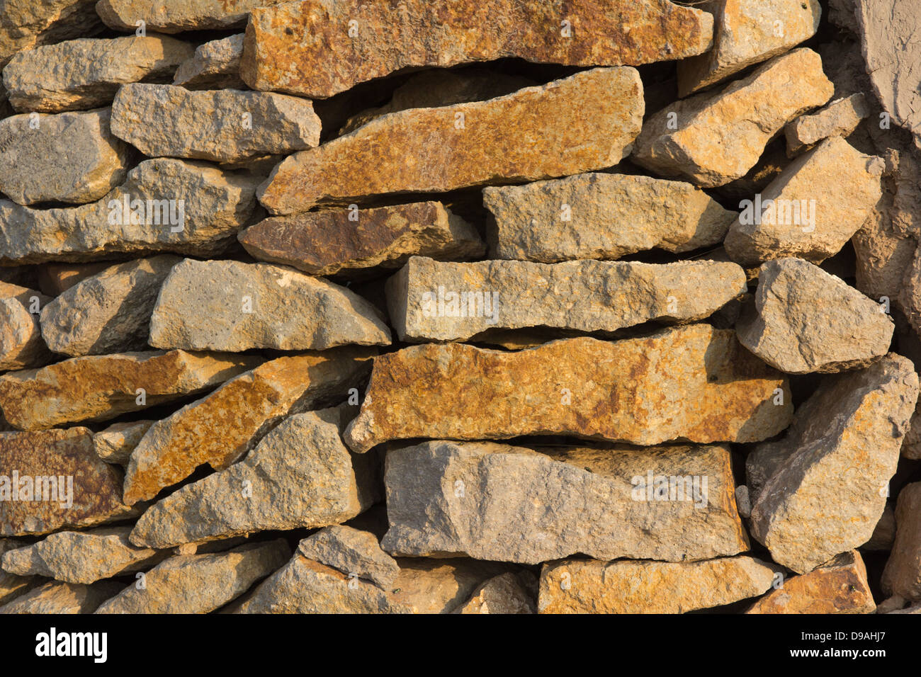 Wall made of natural stone Stock Photo - Alamy