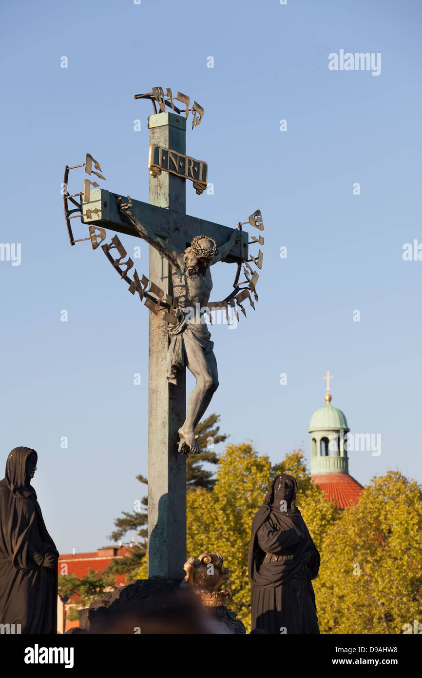 A statue of Jesus Christ on the cross at Charles Bridge Prague, Czech ...