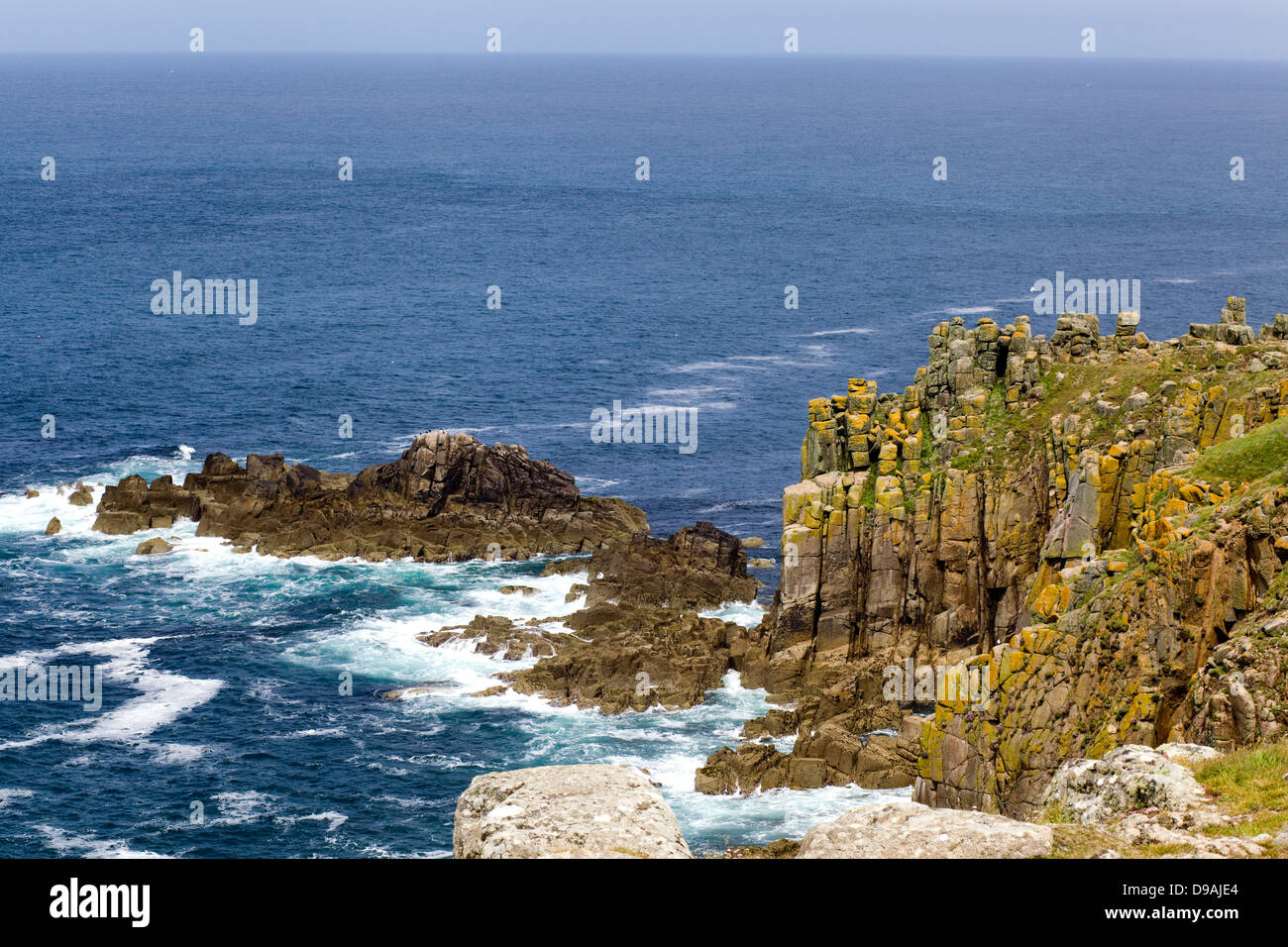 Rocks on the shoreline on an English Beach in Devon England Stock Photo ...