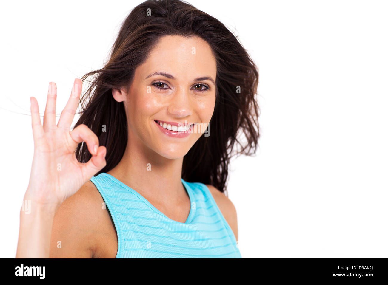 pretty young woman giving ok hand sign over white background Stock ...
