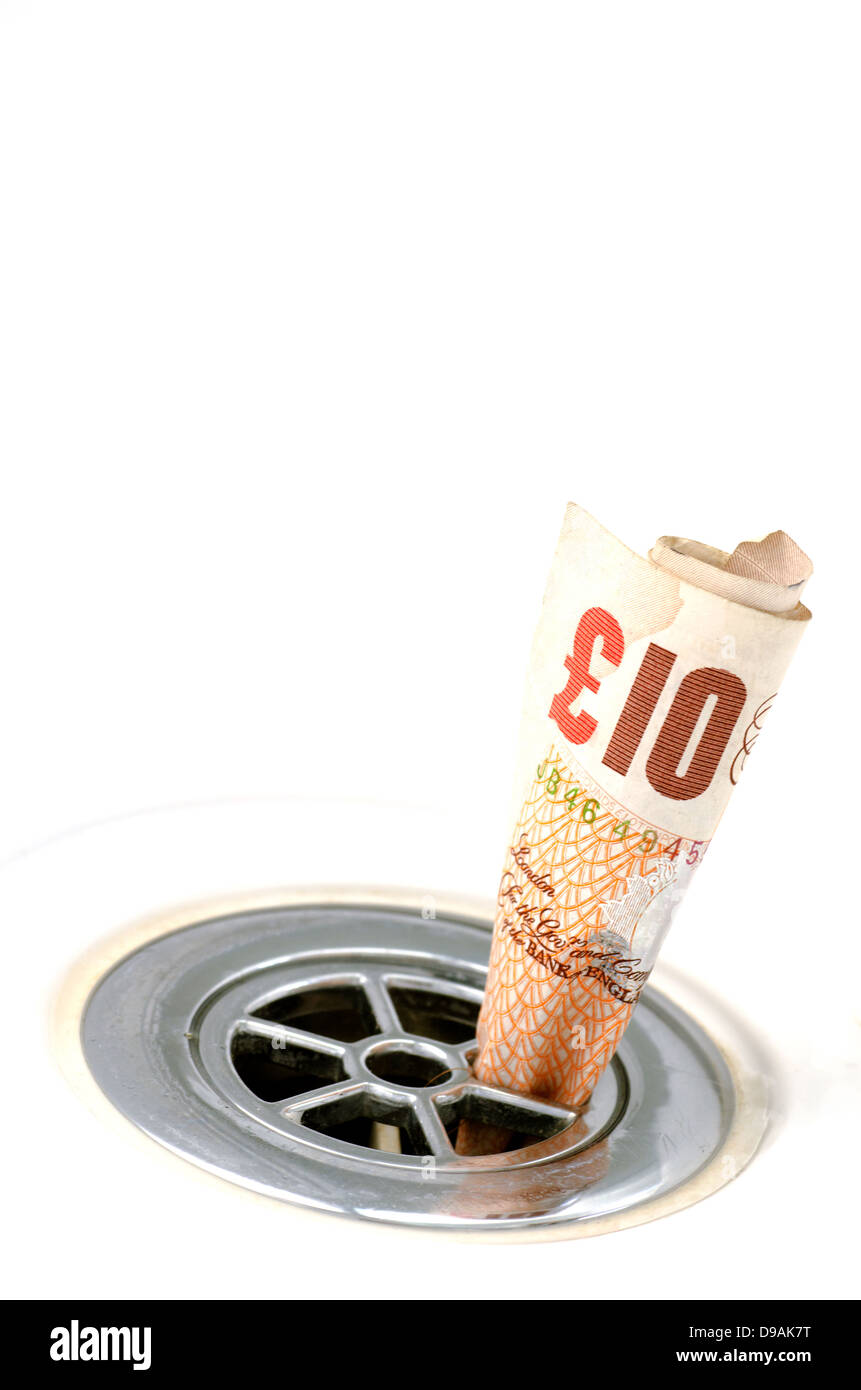 Rolled up ten pound note in a plug hole Stock Photo - Alamy