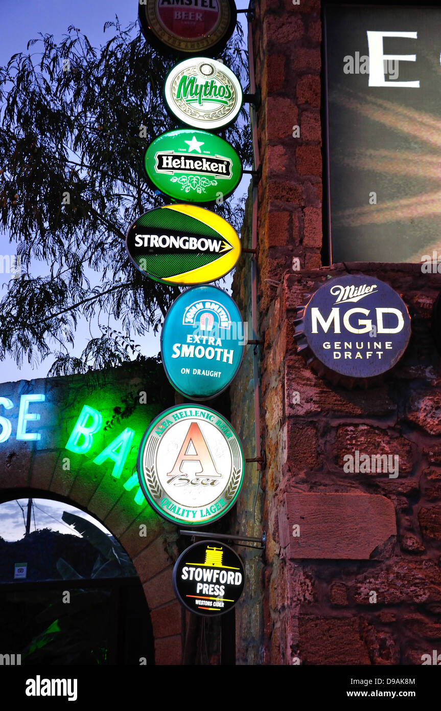 Neon beer signs outside 'Eclipse' cocktail bar at dusk, Pefkos, Rhodes ...