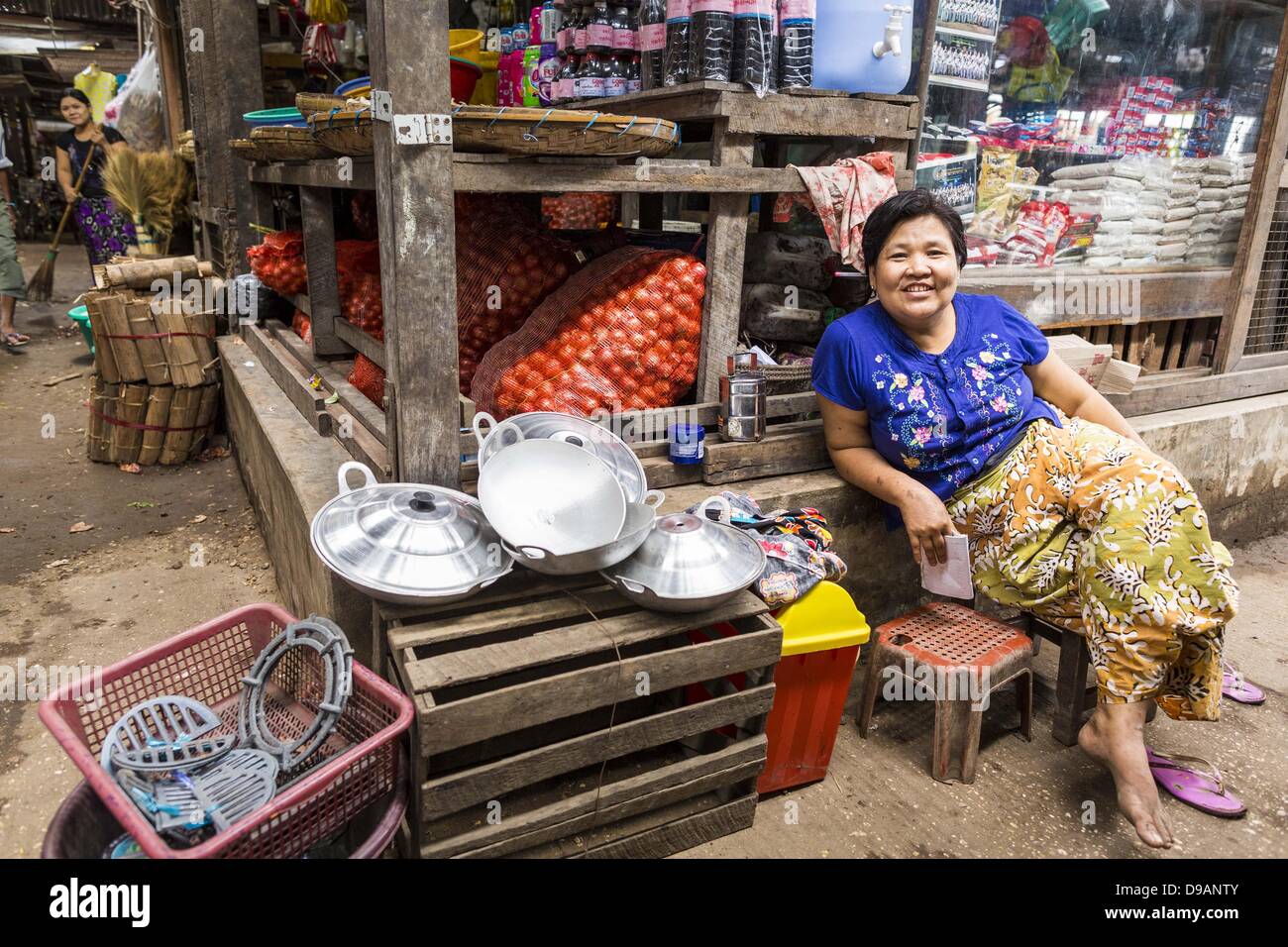 June 14, 2013 - Pathein, Ayeyarwady, Union of Myanmar - A vendor in the ...