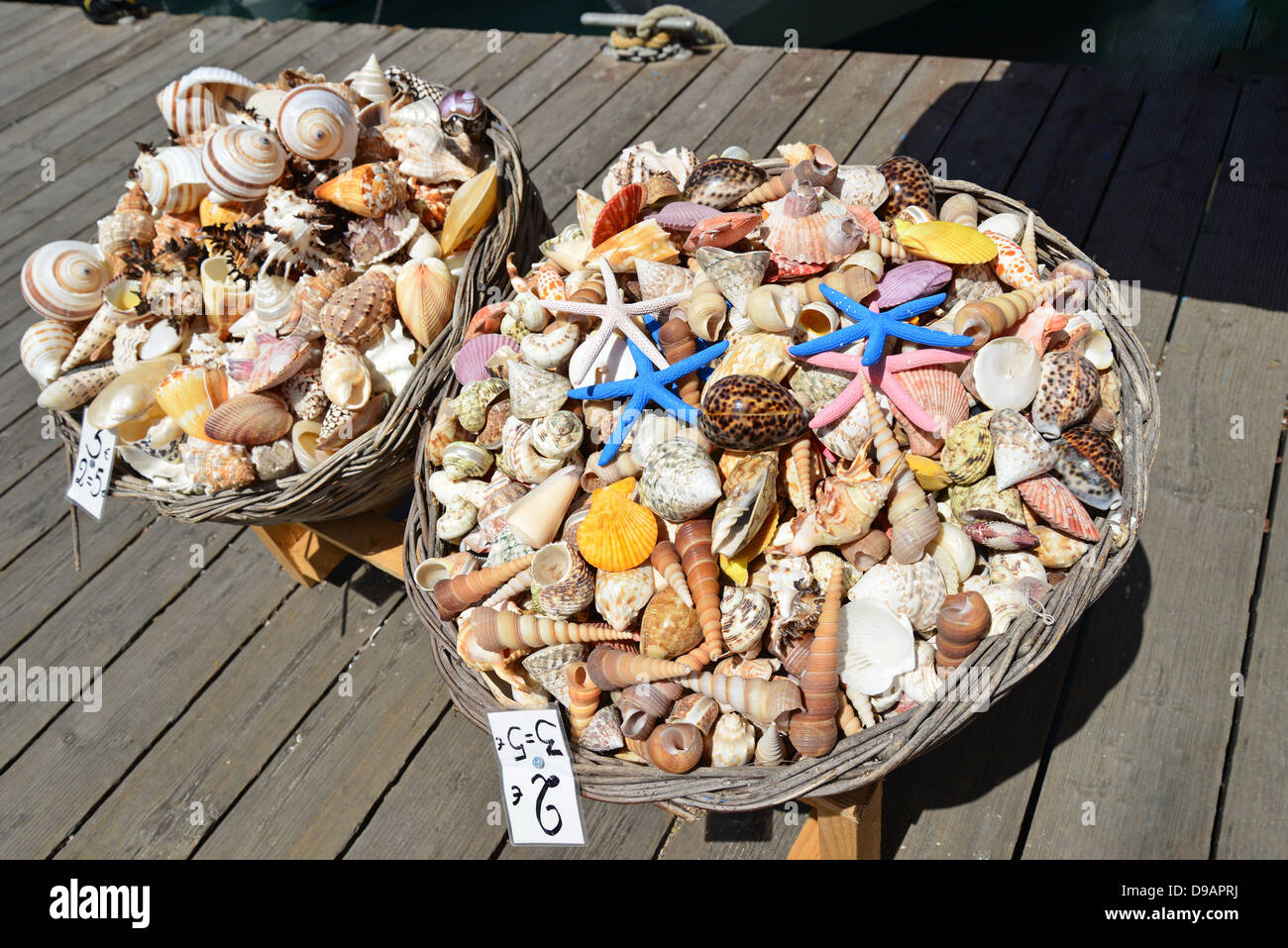 Baskets of shells on souvenir stall, Kolona Harbour, Old Town, City of ...