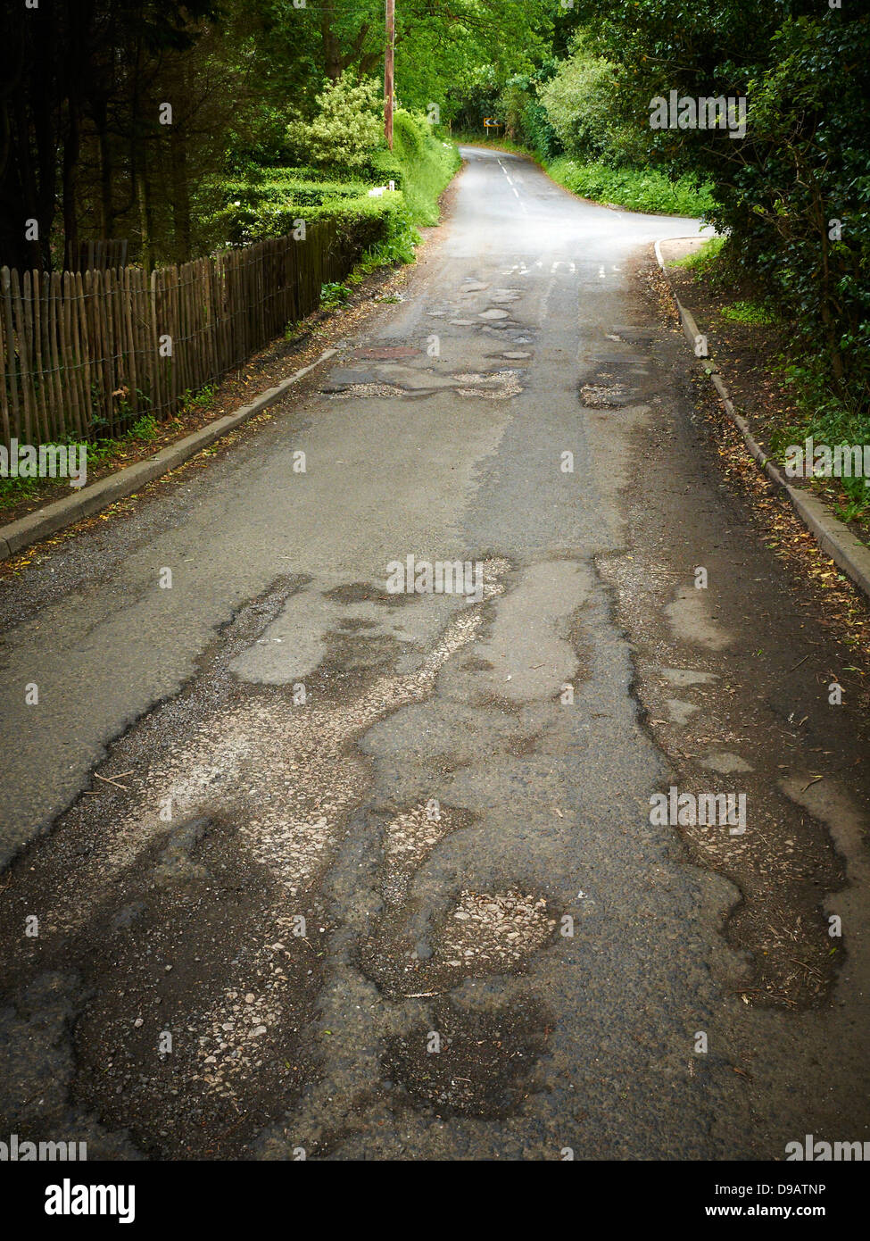 Potholed street hi-res stock photography and images - Alamy