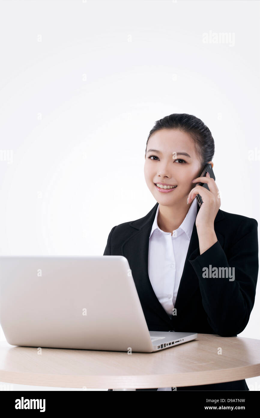 Oriental fashion business woman using computer Stock Photo - Alamy