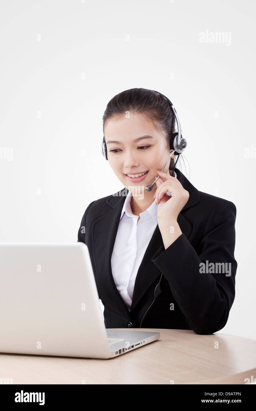 Oriental fashion business woman using computer Stock Photo - Alamy