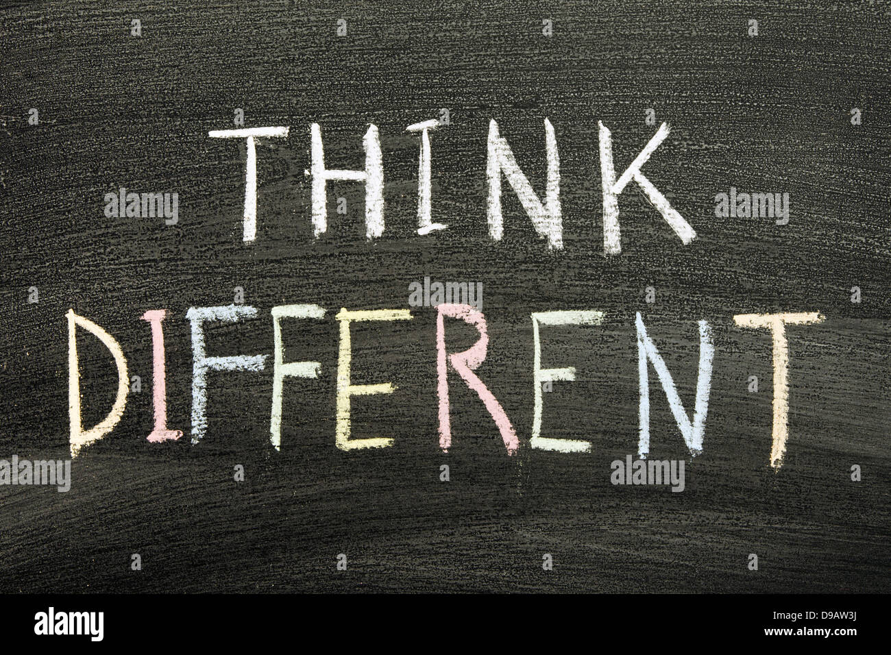 think different phrase handwritten on school blackboard Stock Photo - Alamy