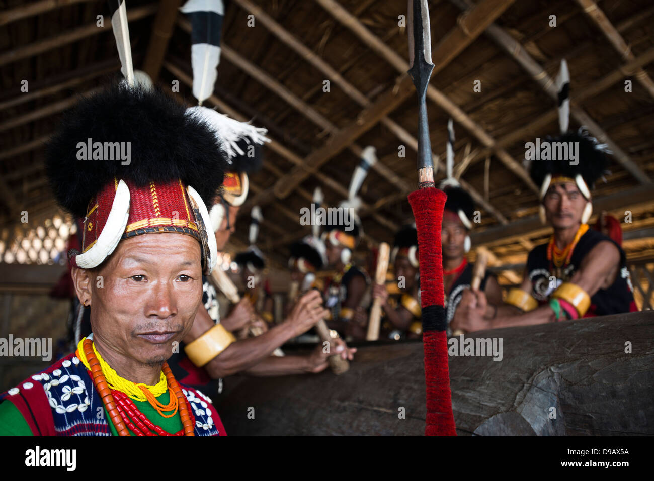 Naga tribal warrior in traditional outfit standing with a spear in a ...
