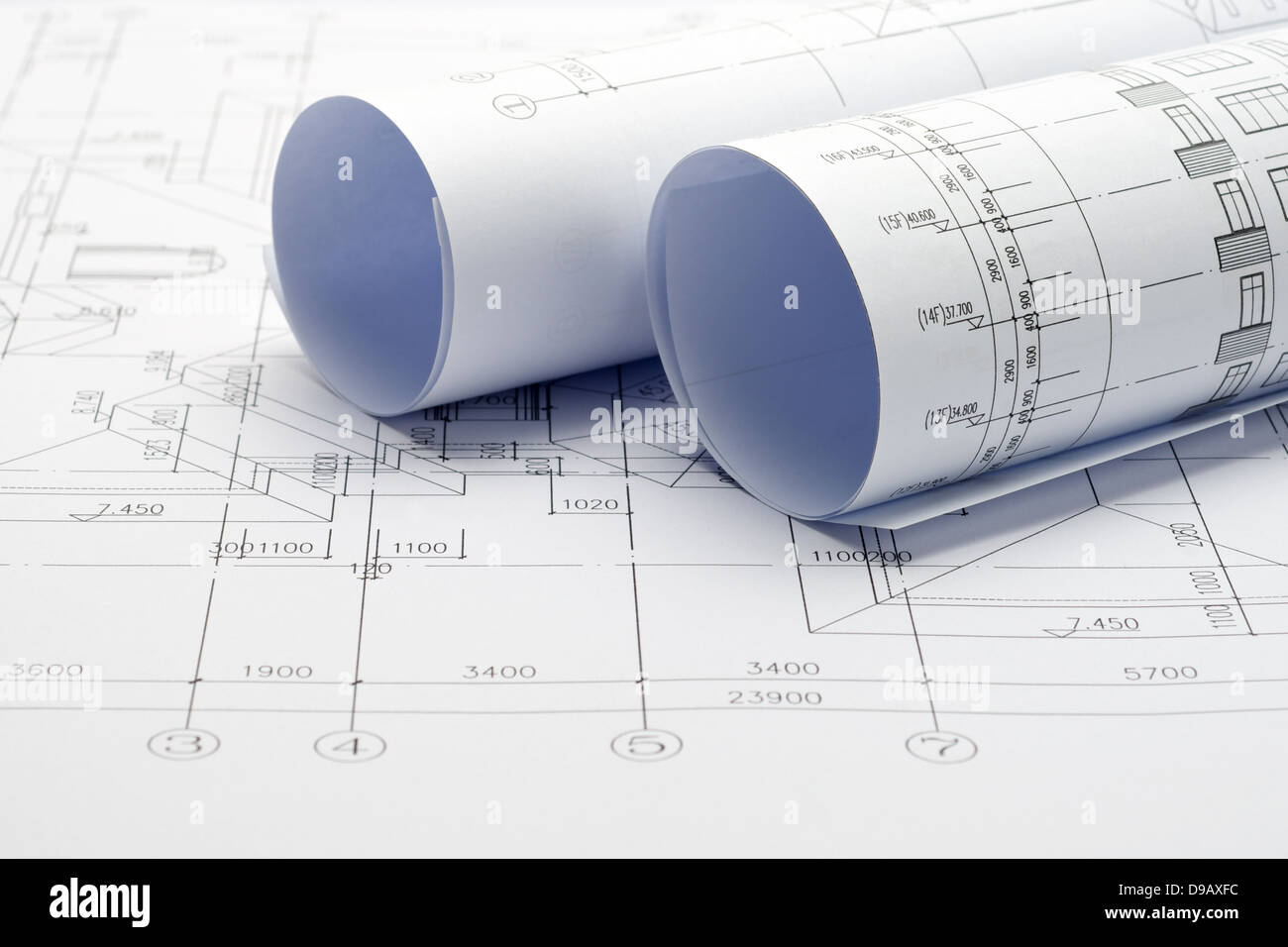 Construction plan blueprint rolls with drawings Stock Photo - Alamy