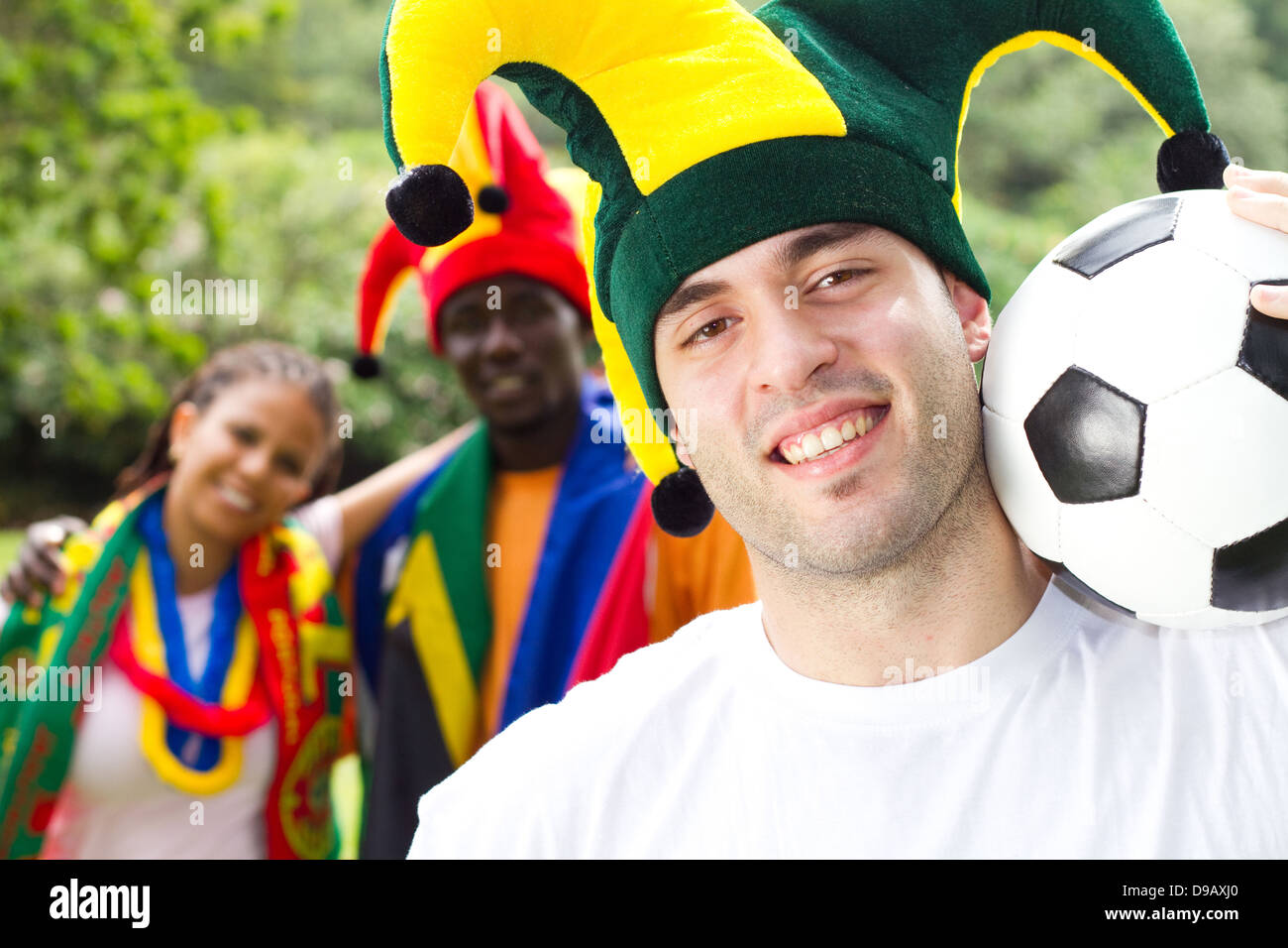 Happy multicultural football fans hi-res stock photography and images ...