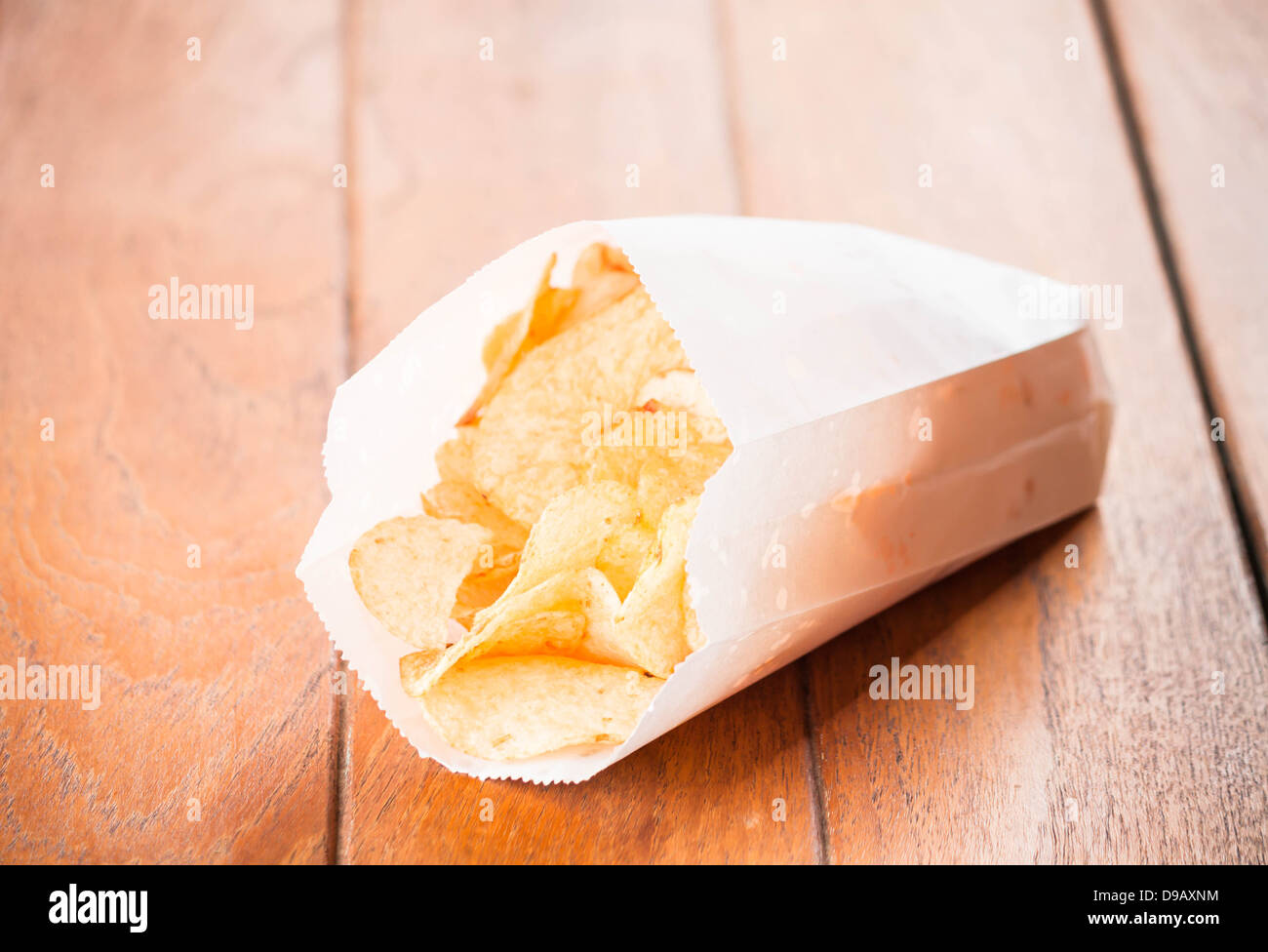 Potato chips in paper hi-res stock photography and images - Alamy
