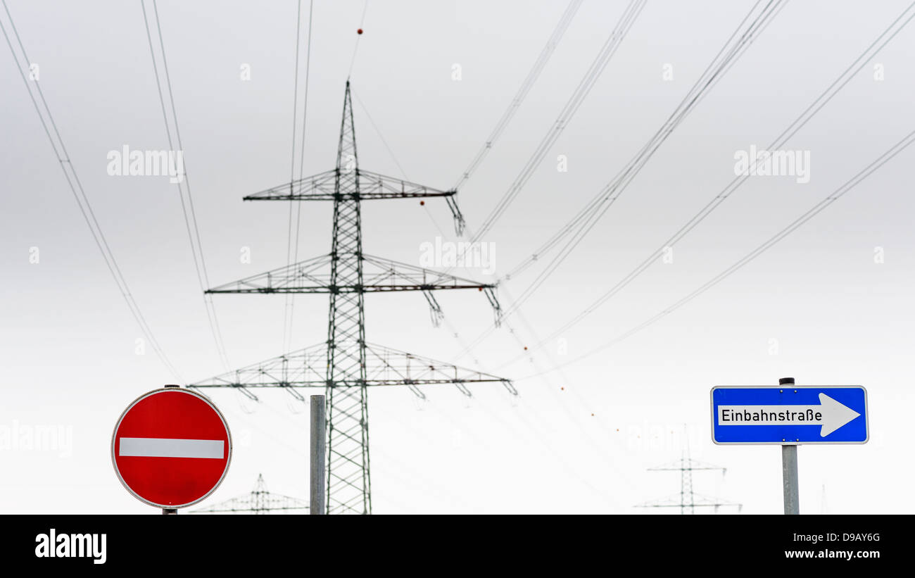 Germany, North Rhine Westphalia, Road signs for one way and power poles ...