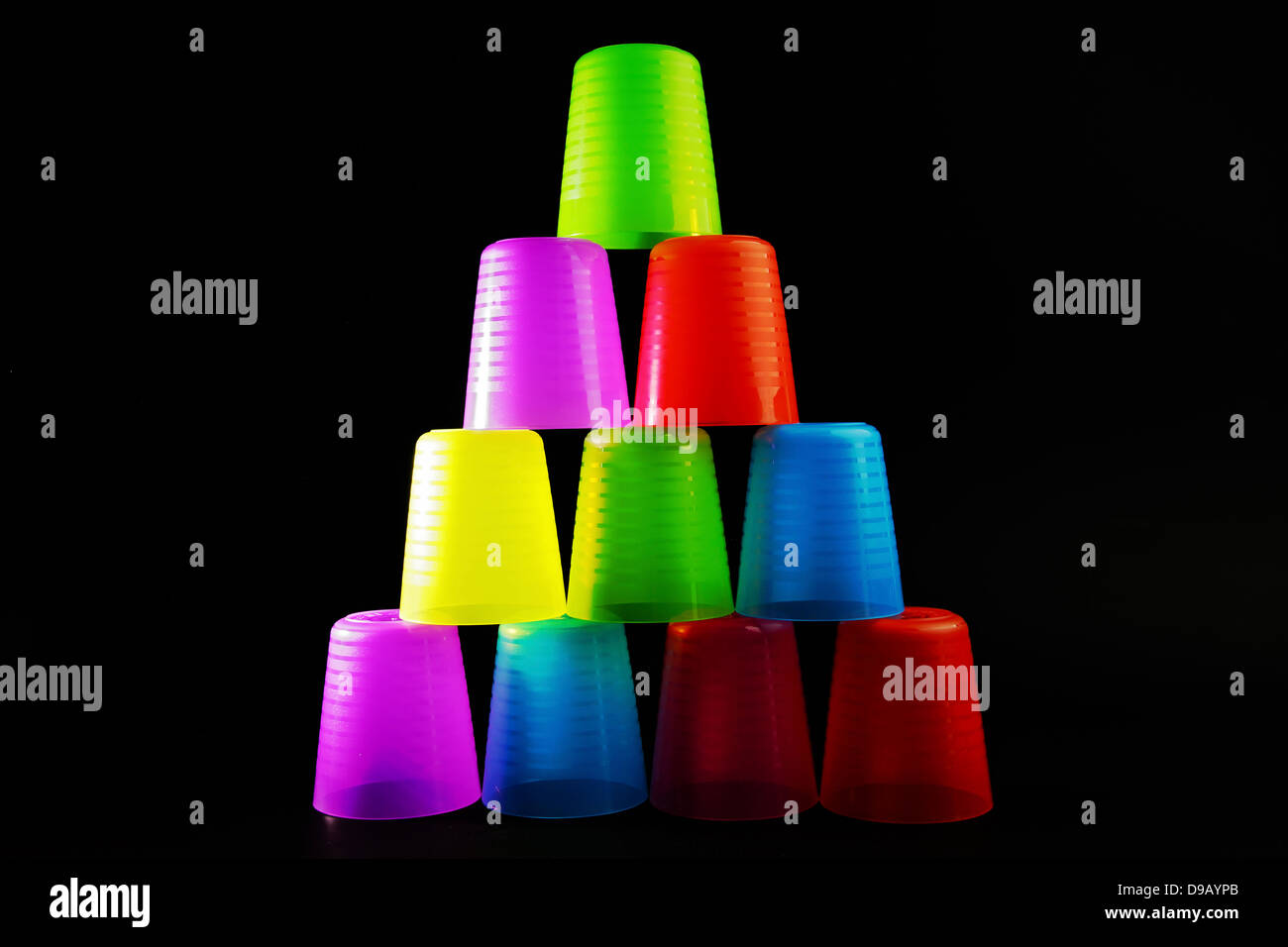 Pyramid of colorful plastic cups, close-up Stock Photo - Alamy