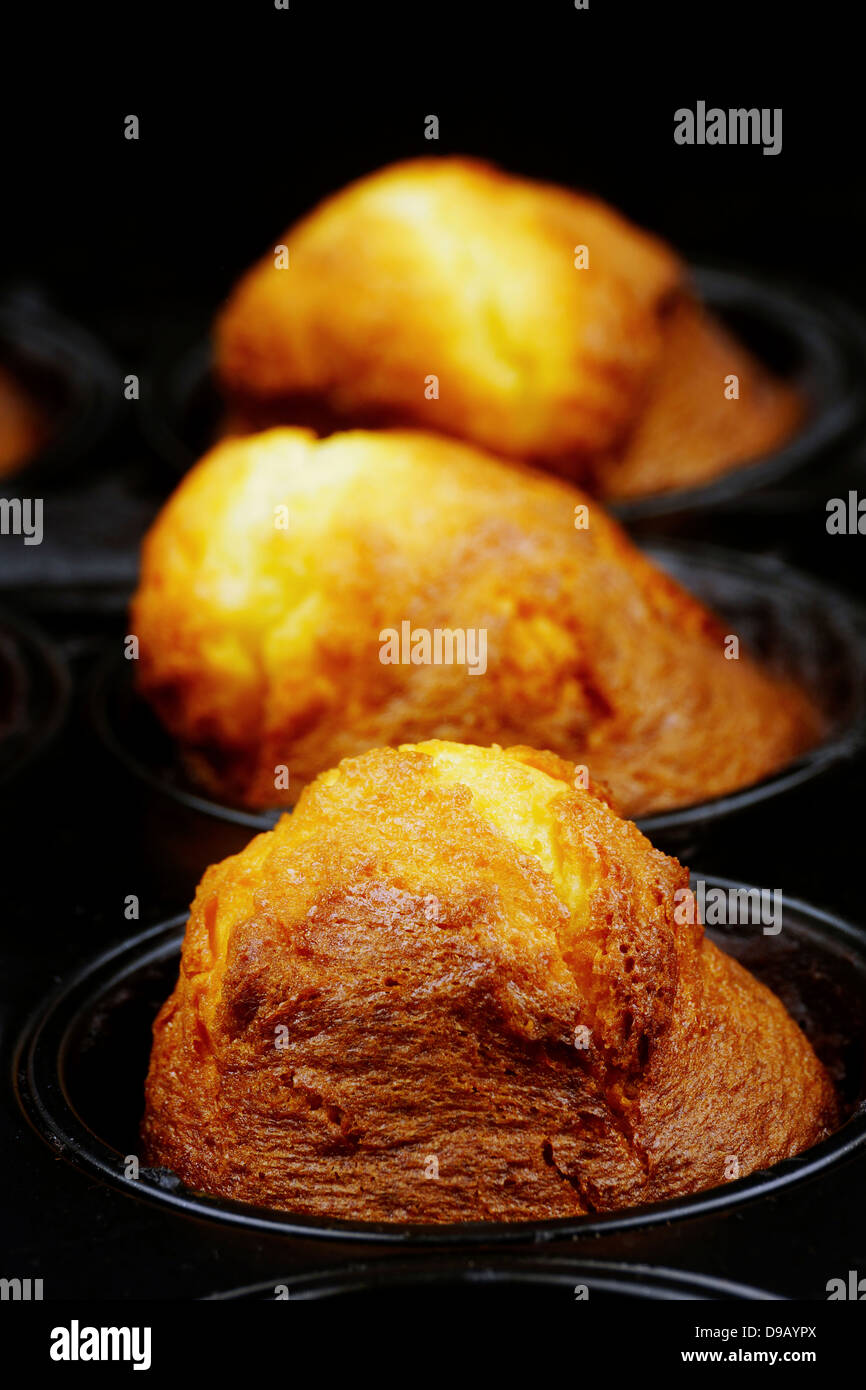 Muffins in row, close up Stock Photo - Alamy