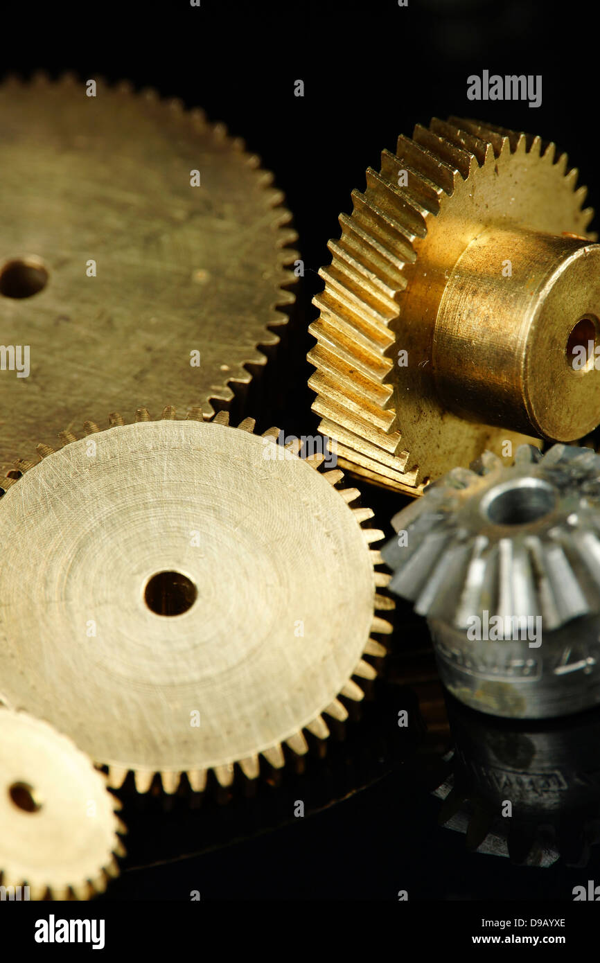 Toothed wheel on black background, close up Stock Photo - Alamy