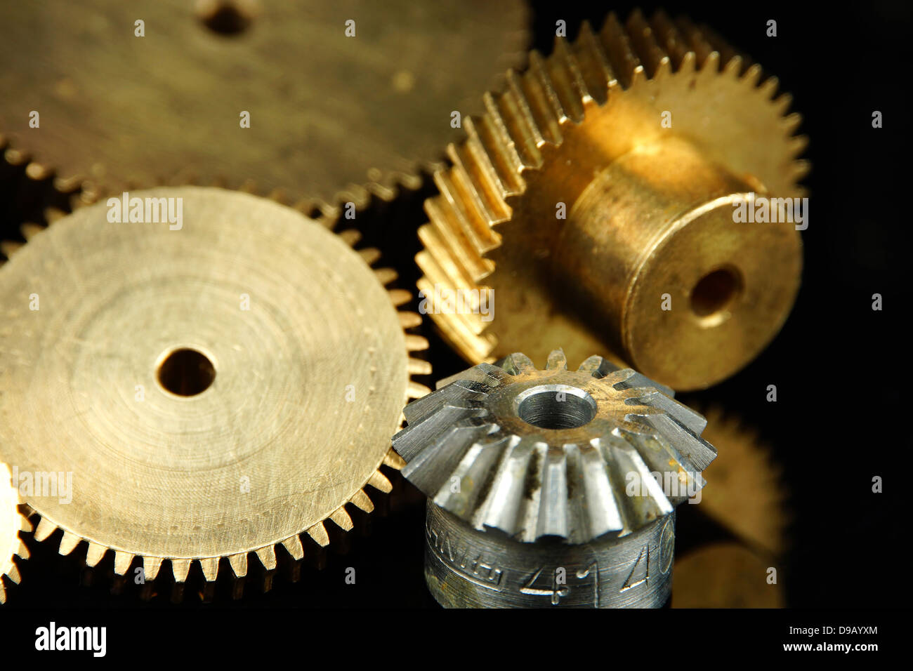 Toothed wheel on black background, close up Stock Photo - Alamy