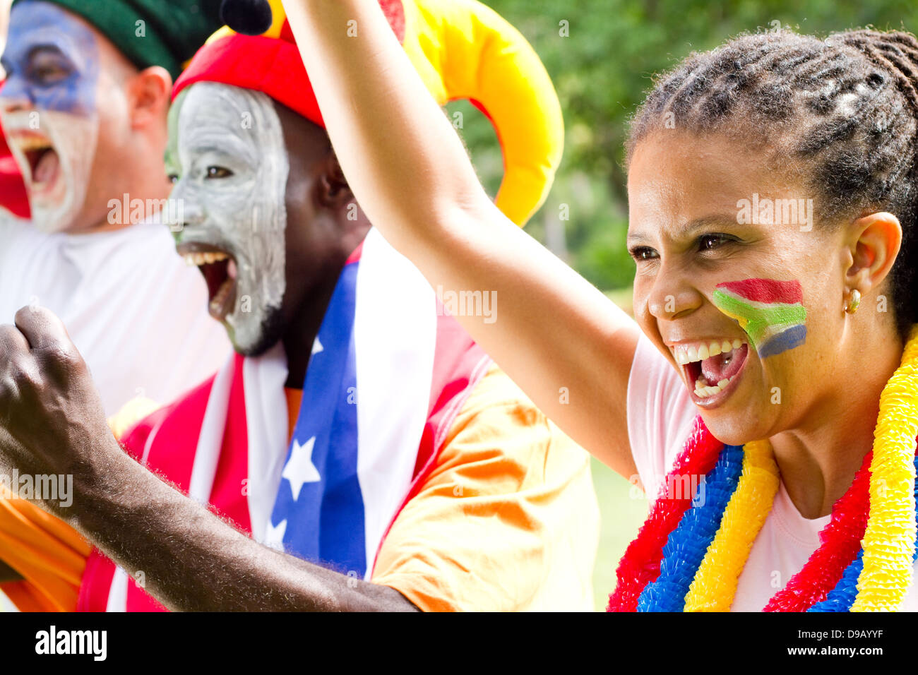 super excited sports fans watching a game Stock Photo - Alamy