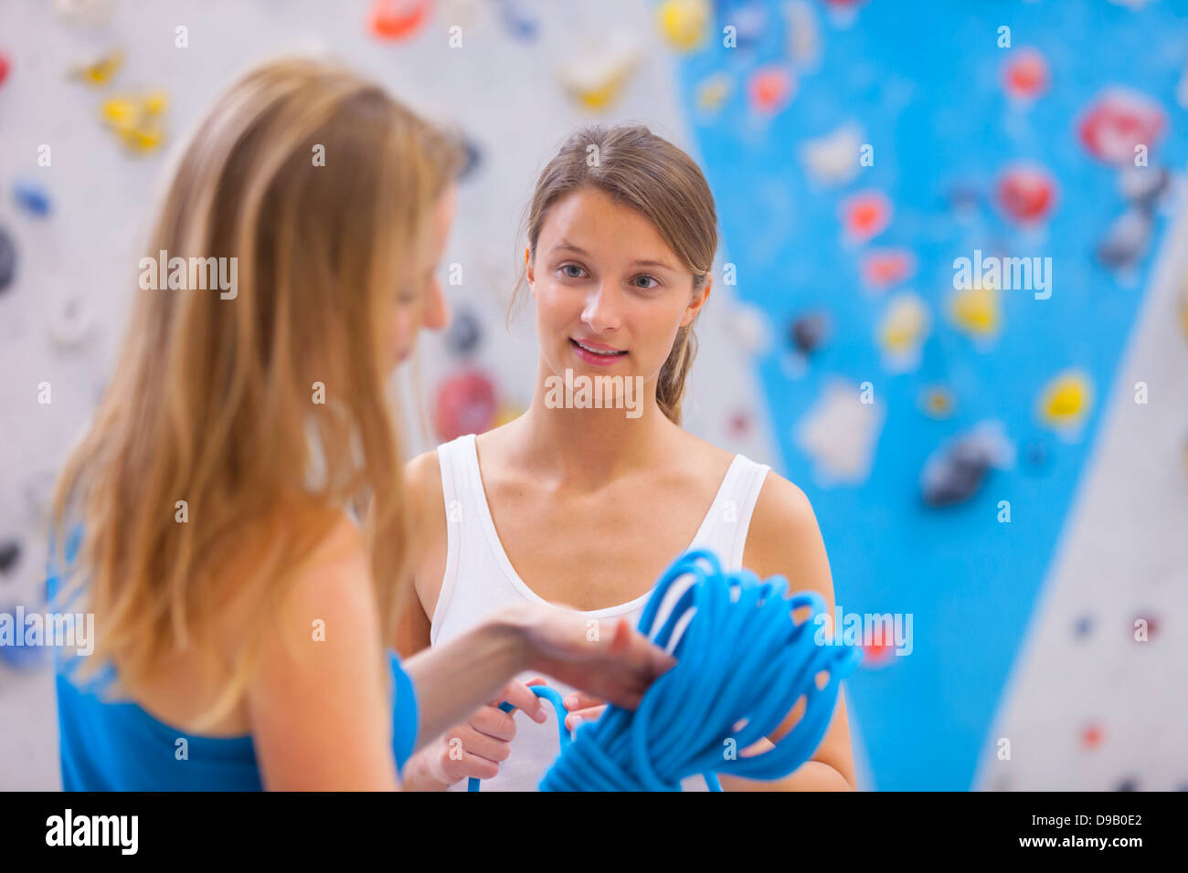 Germany, Bavaria, Munich, Young climbers with rope, smiling Stock Photo ...