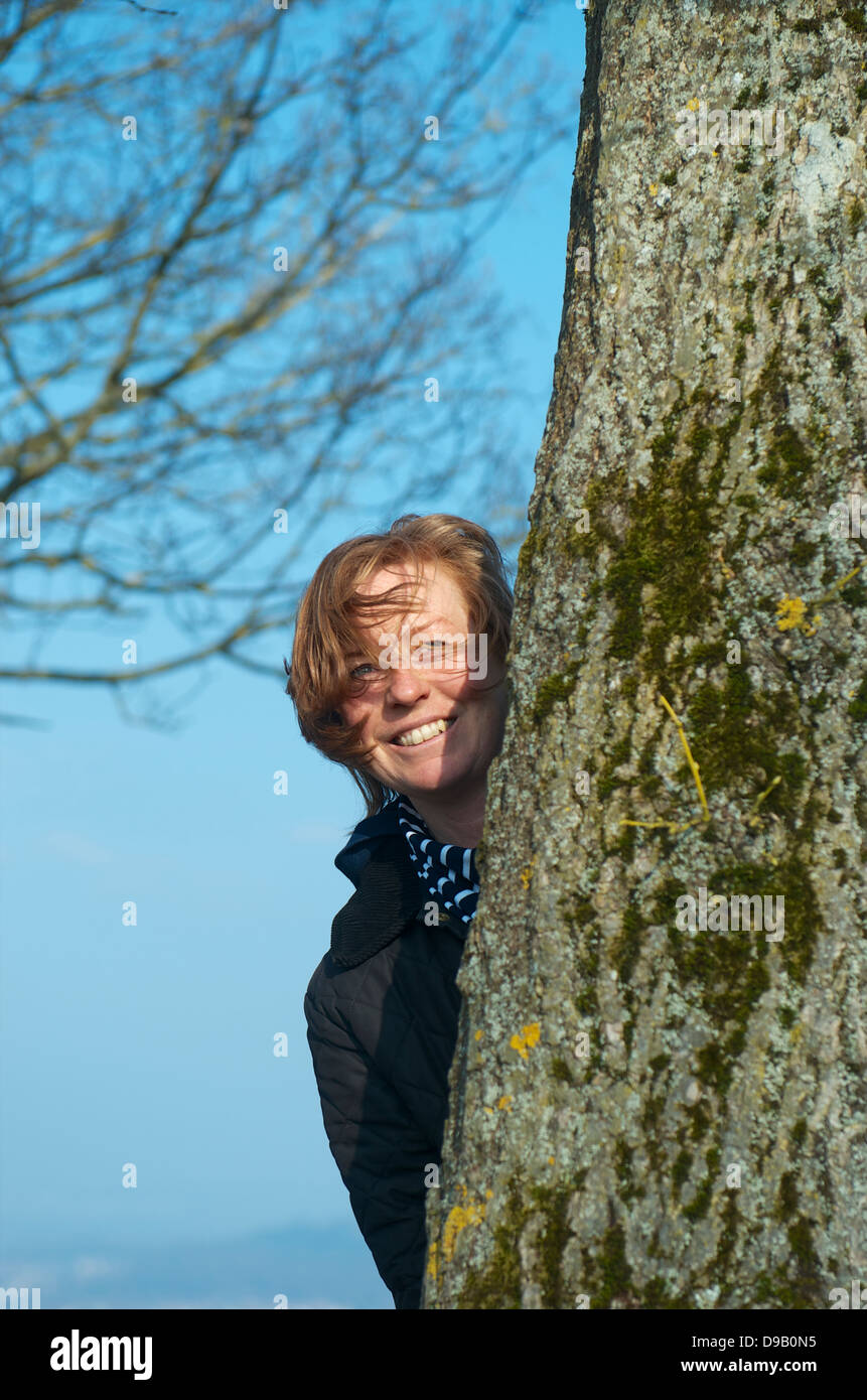 Germany, Baden Wuerttemberg, Constance, Mature woman hidding behind ...