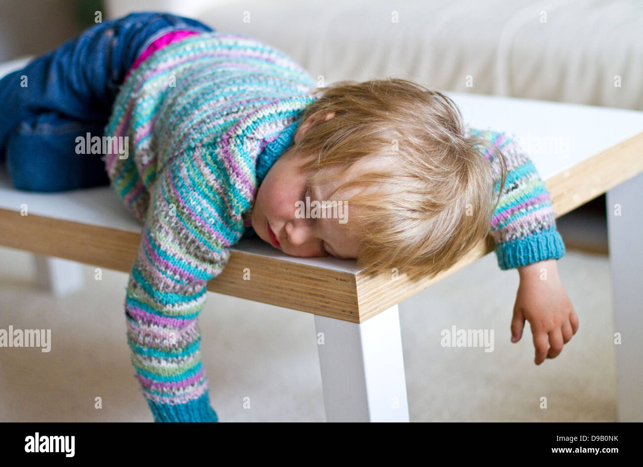 Girl sleeping on table hi-res stock photography and images - Alamy