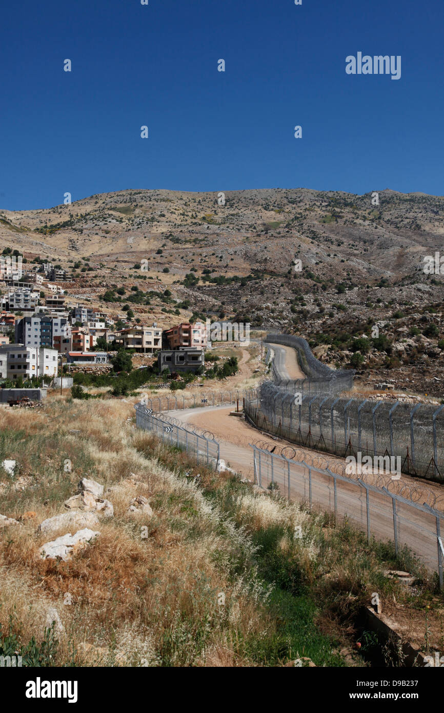 A border fence in the village of Majdal Sham divides the Israeli ...