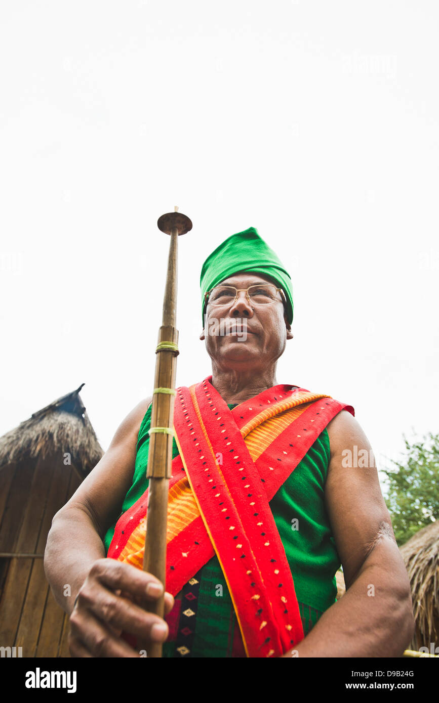 Naga tribal man holding a wind instrument, Hornbill Festival, Kohima ...