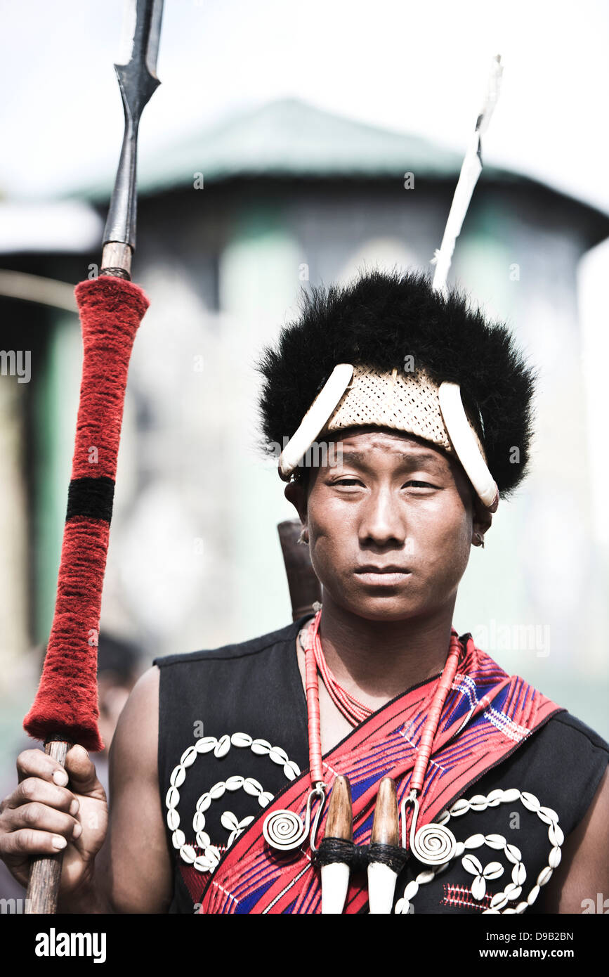 Naga tribesman in traditional outfit holding a spear during the annual ...