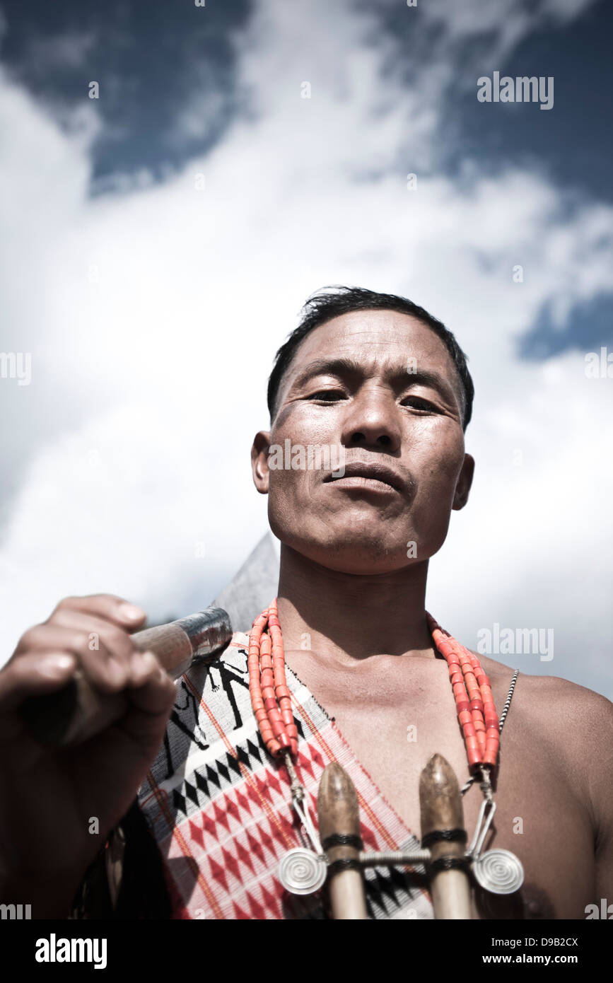 Naga tribesman holding a machete during the annual Hornbill Festival at ...