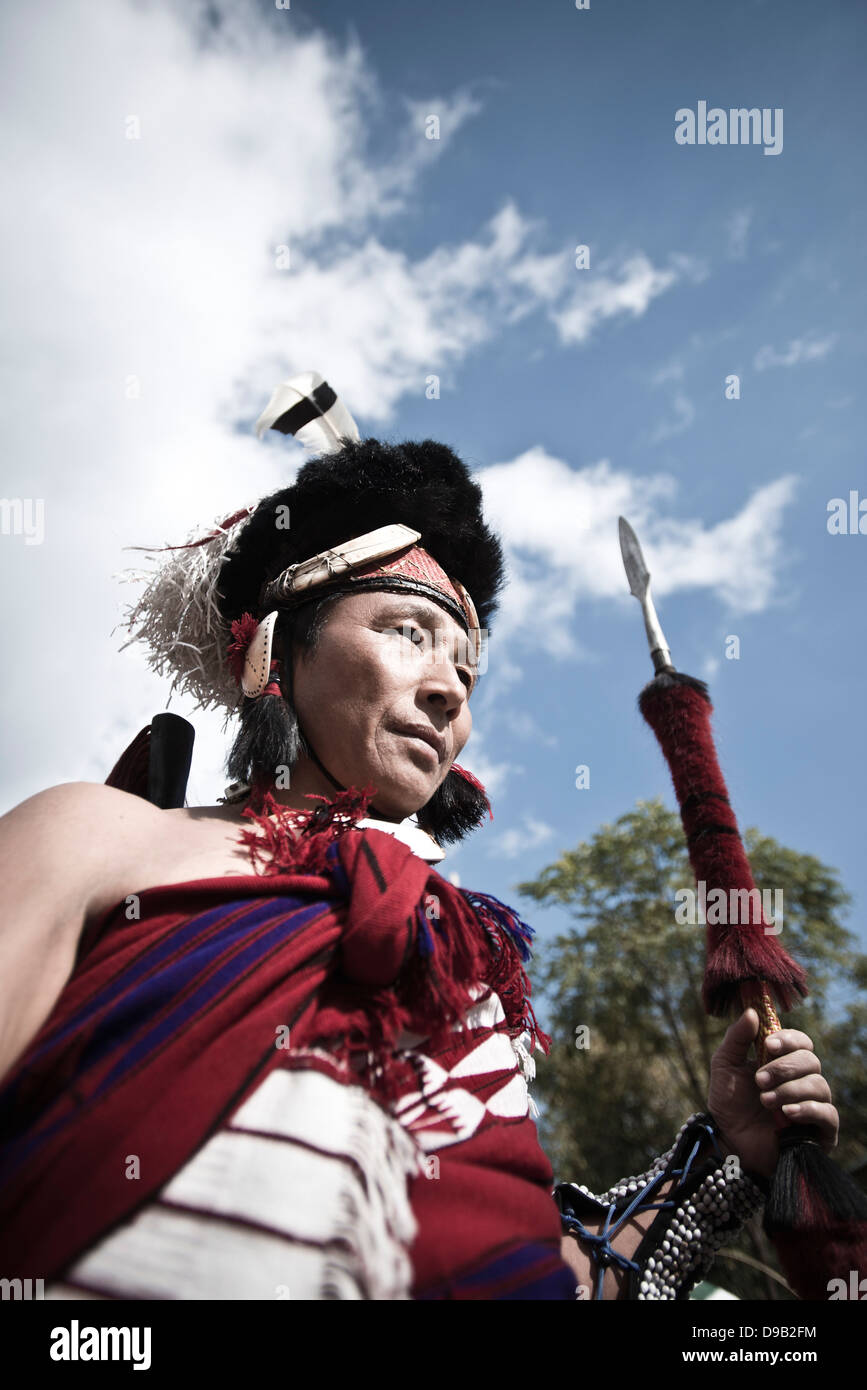 Naga tribesman in traditional outfit holding a spear during the annual ...