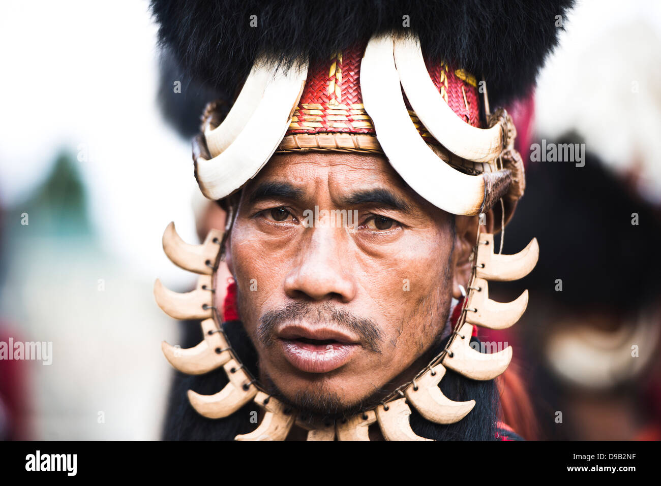 Portrait of Naga tribesman in traditional outfit during the annual ...