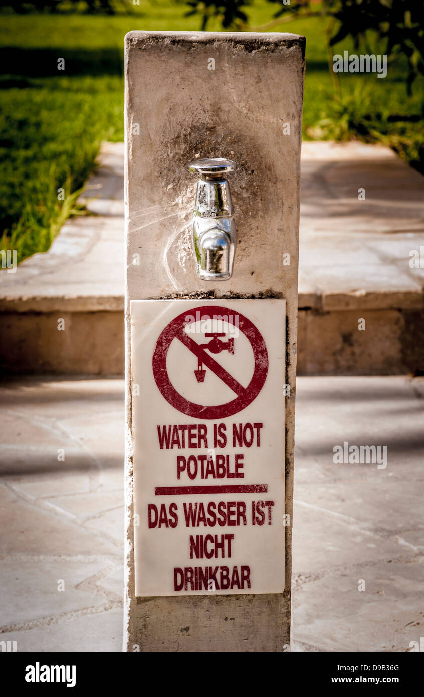 Tap with a water is not potable sign Stock Photo - Alamy