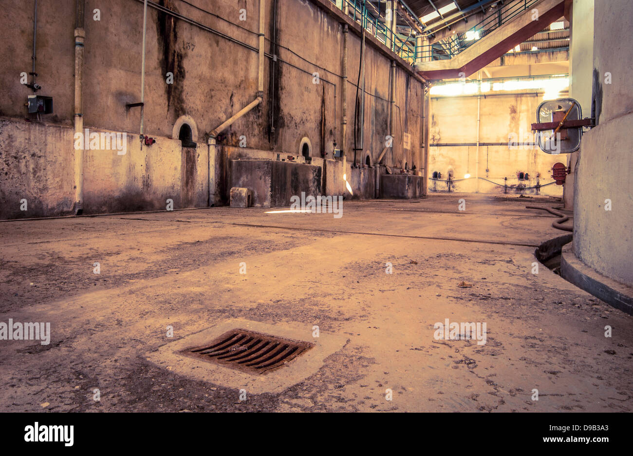 Rusty metal grate in the concrete floor of a disused winery Stock Photo ...