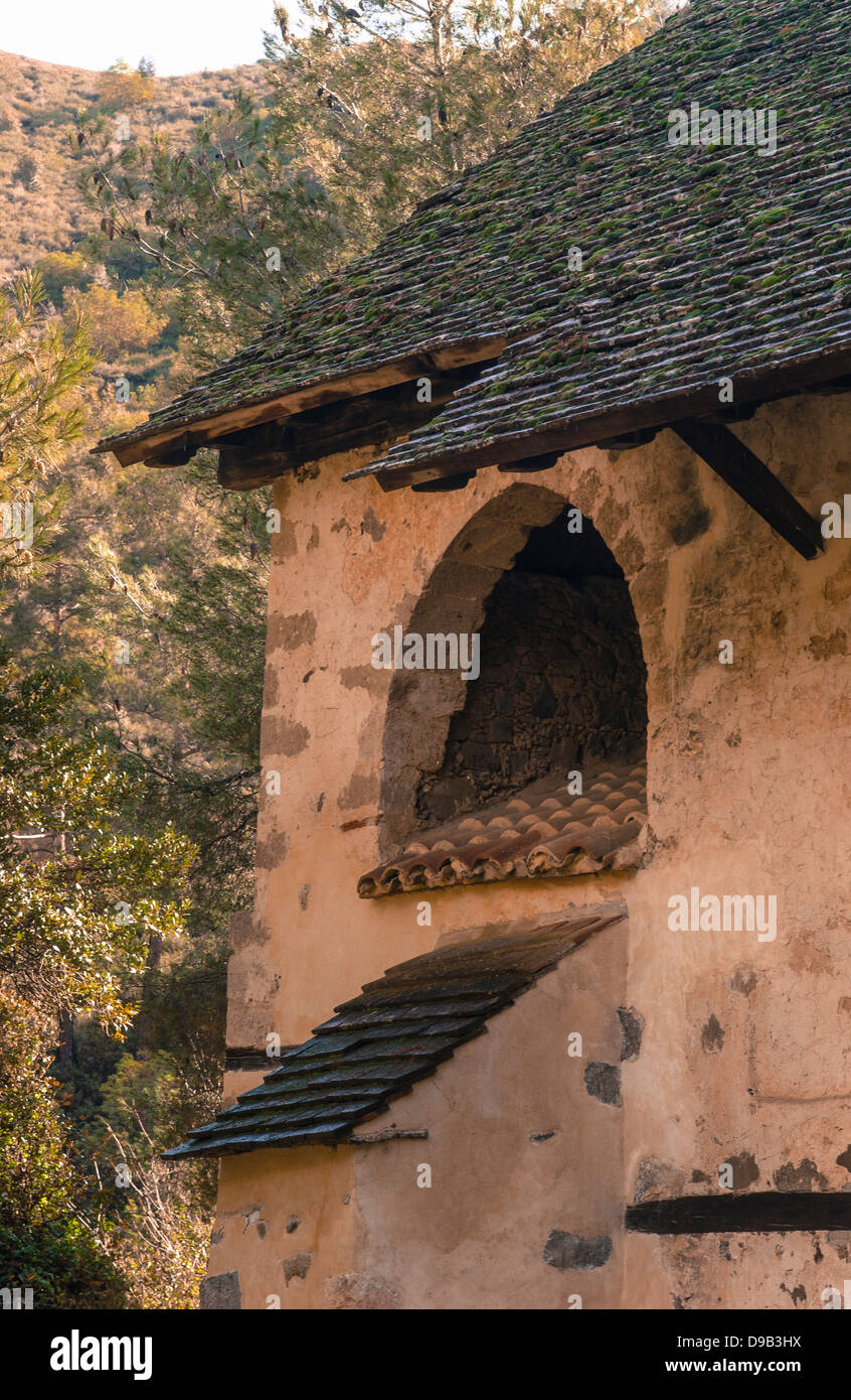 Traditional stone built Cypriot building, situated along a cobbled road ...