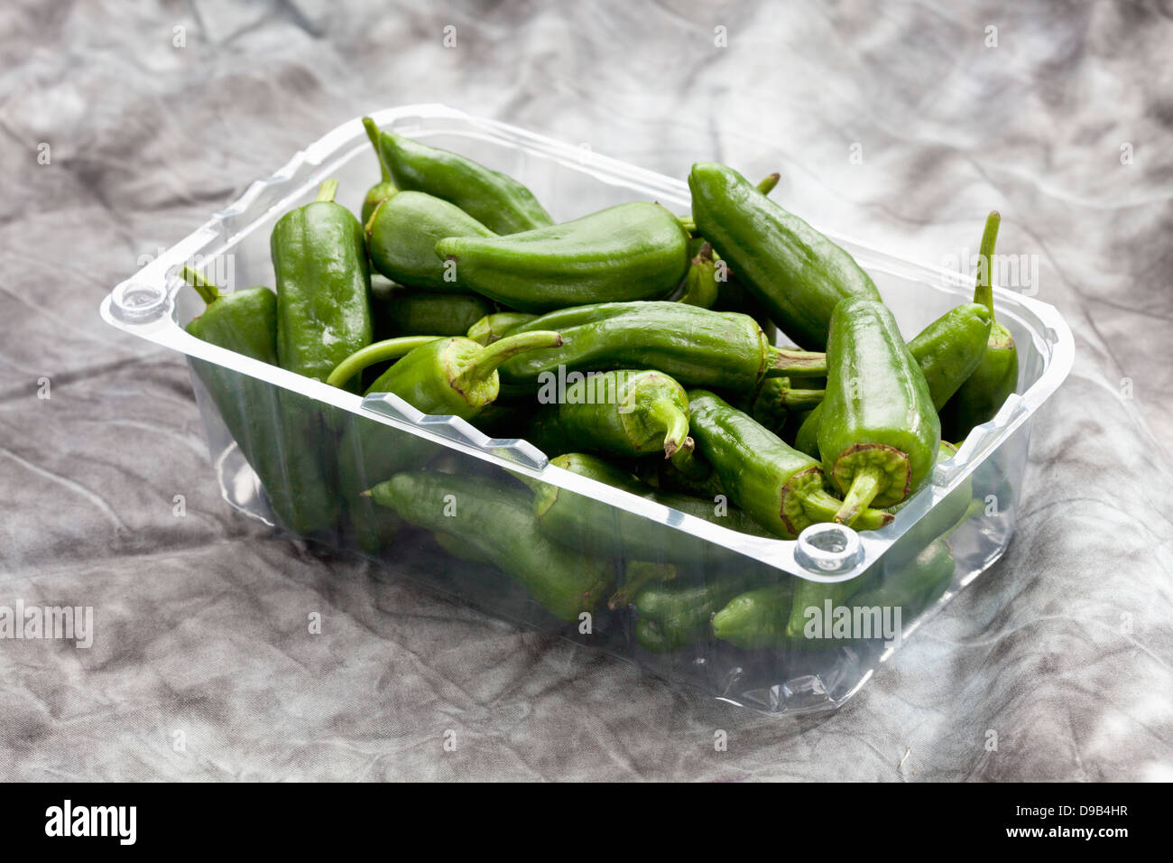 Green pepper in plastic container, close up Stock Photo - Alamy