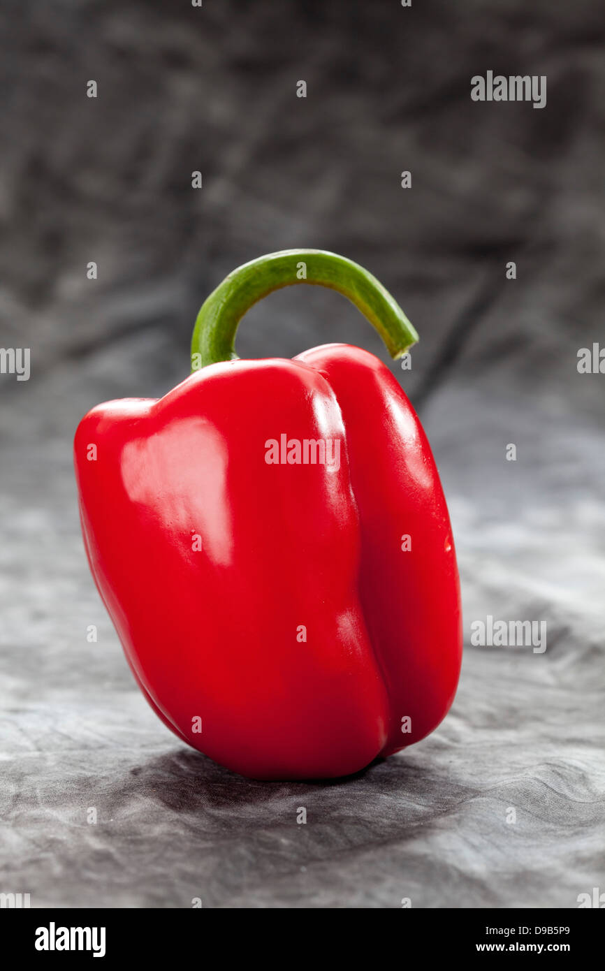 Red bell pepper on grey background, close up Stock Photo - Alamy