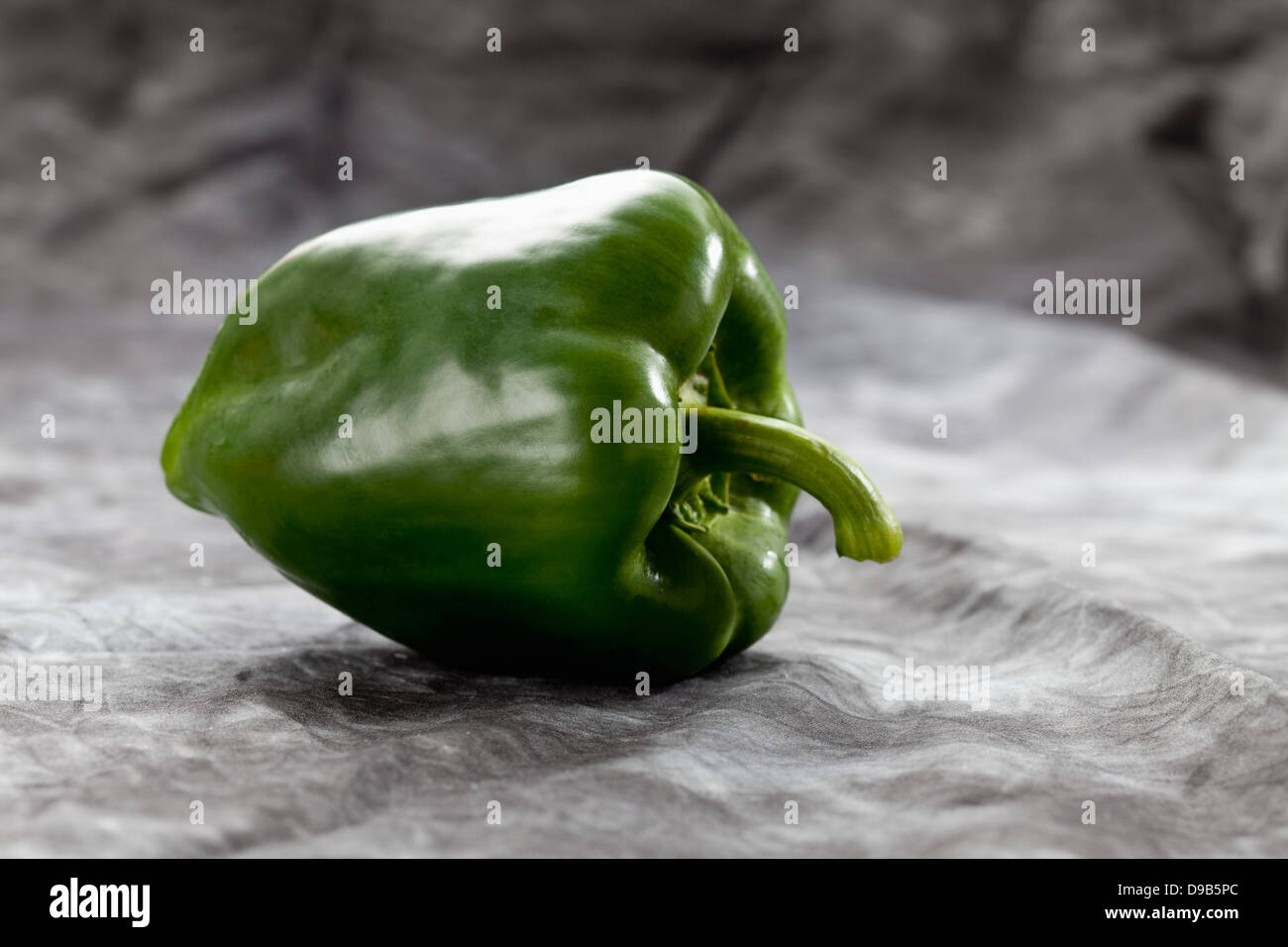 Green pepper on grey background, close up Stock Photo - Alamy