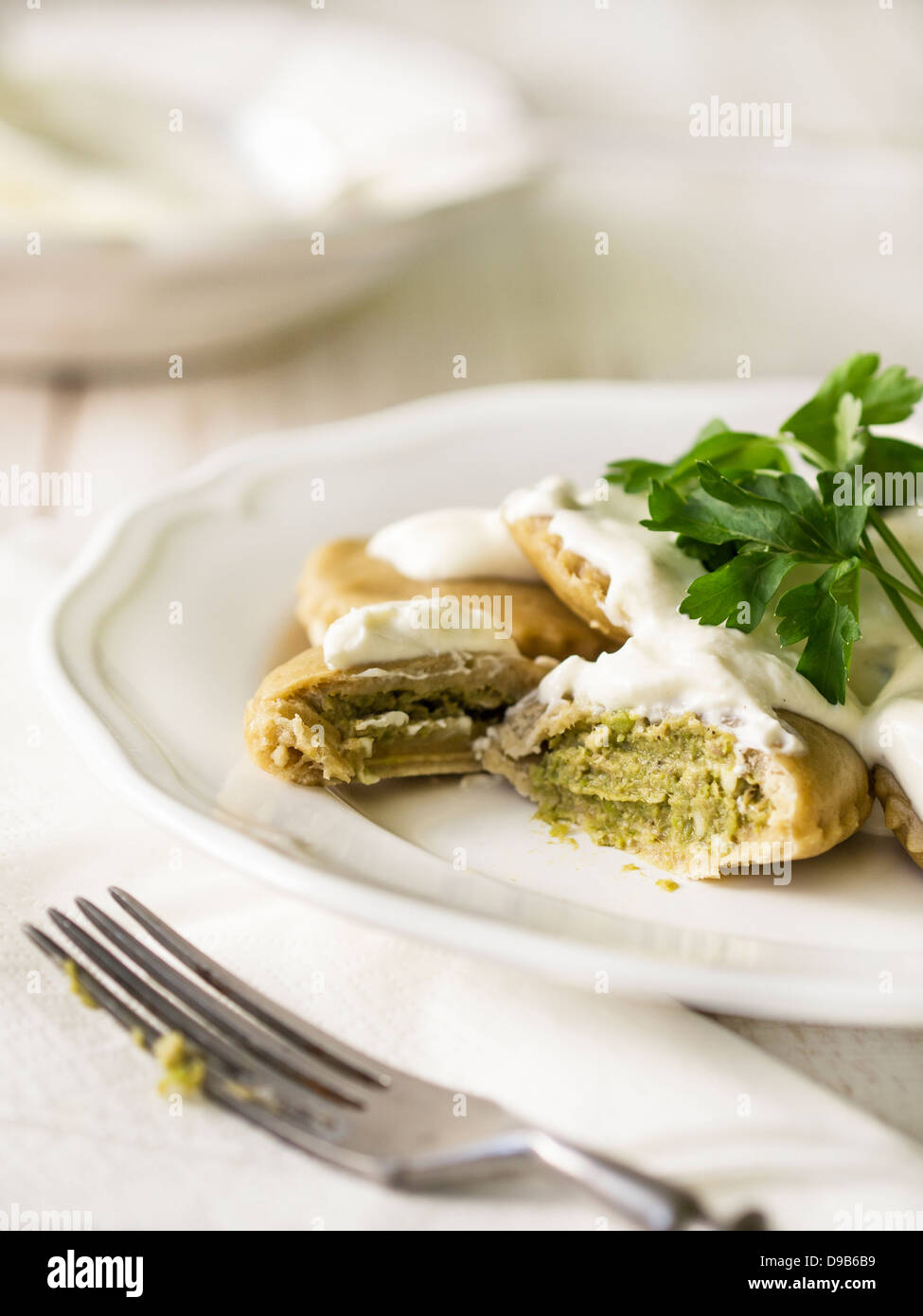 Homemade green pea pesto ravioli with feta sauce Stock Photo - Alamy