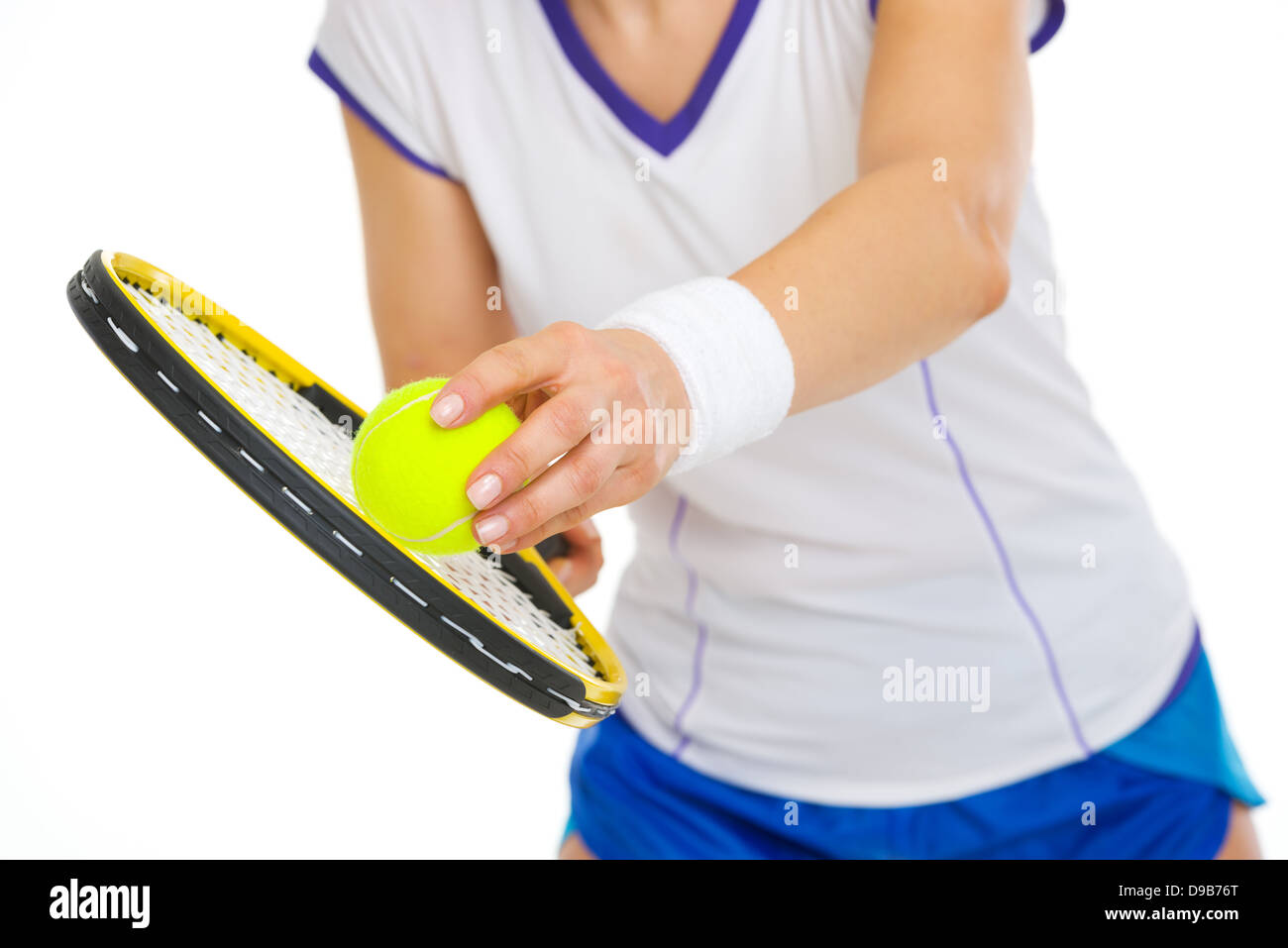 Closeup on female tennis player serving ball Stock Photo - Alamy