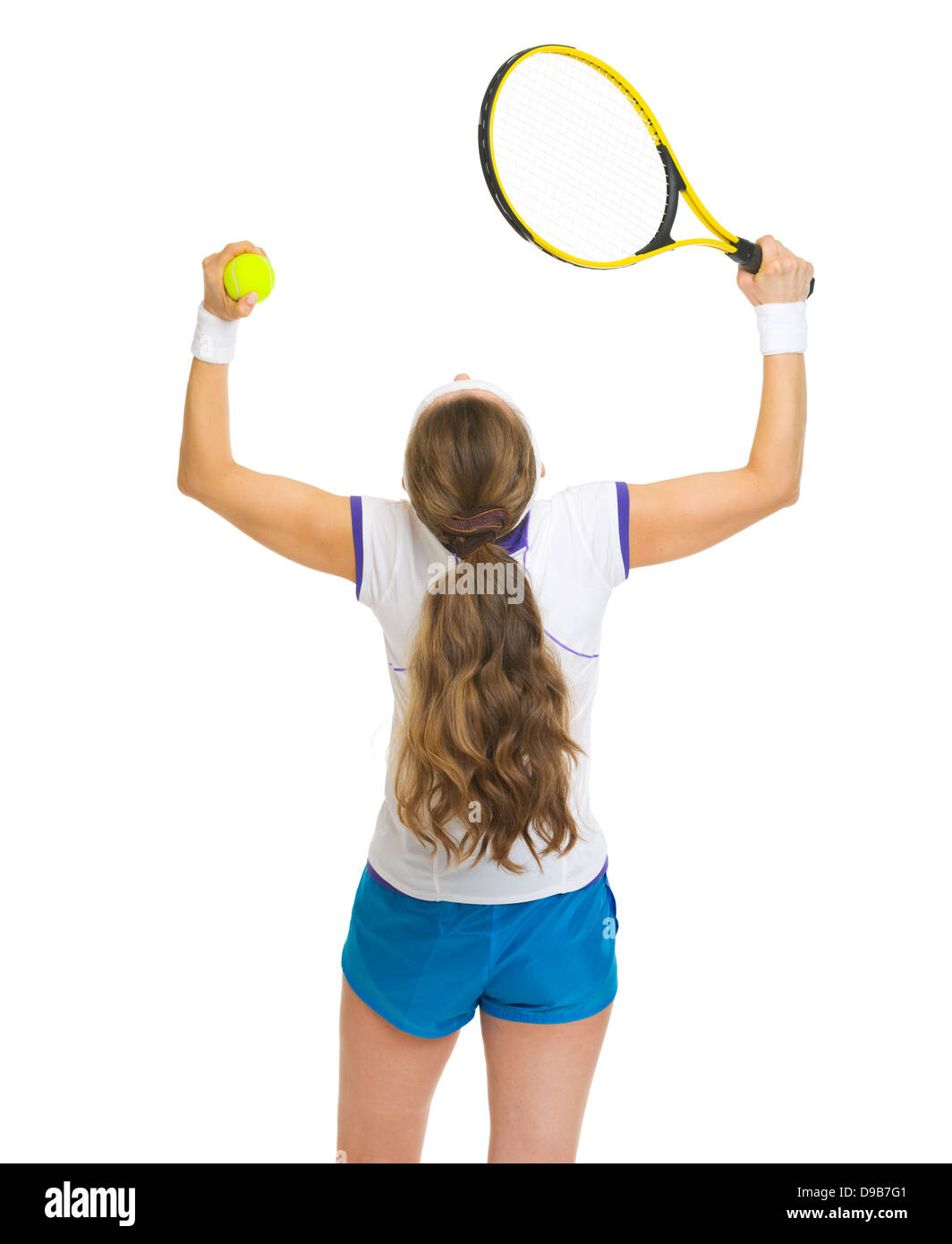 Happy female tennis player rejoicing success. rear view Stock Photo - Alamy