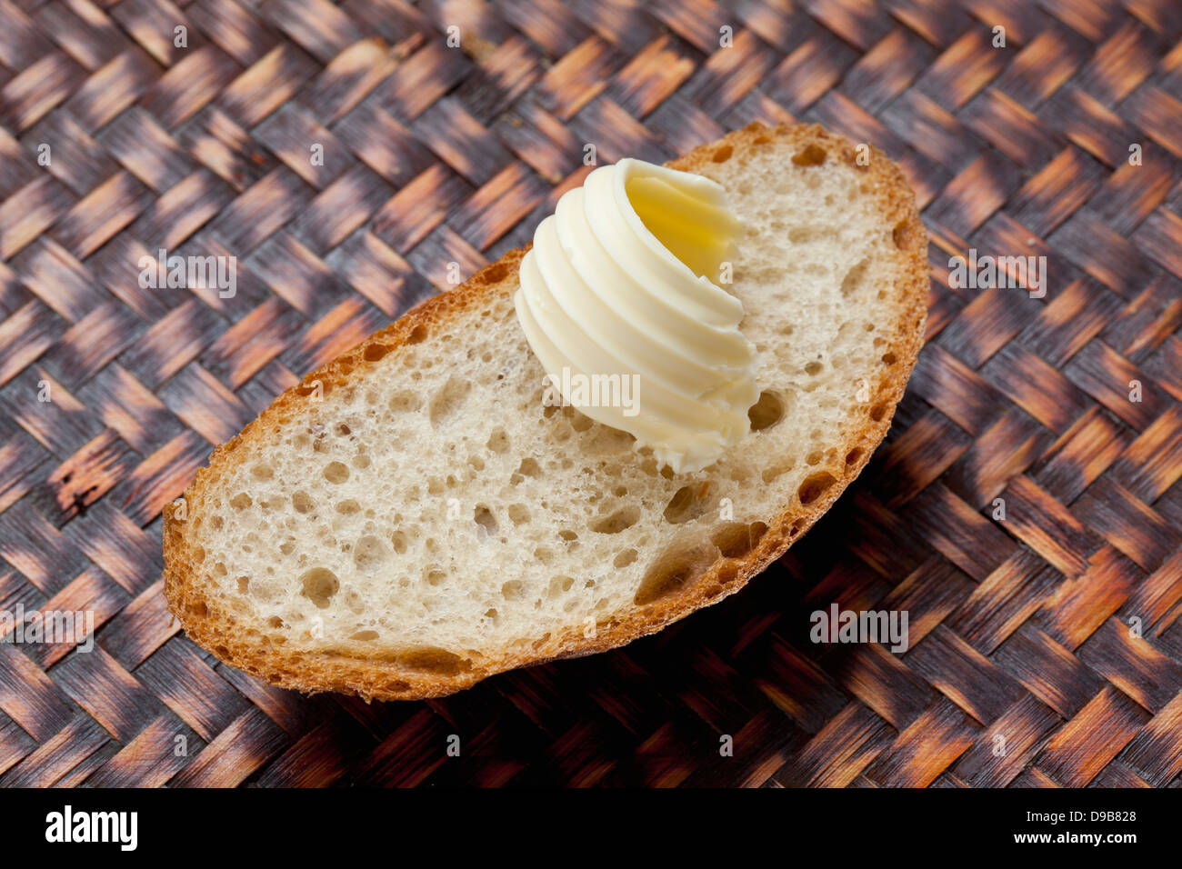 Slice of white bread with curl of butter, close up Stock Photo - Alamy