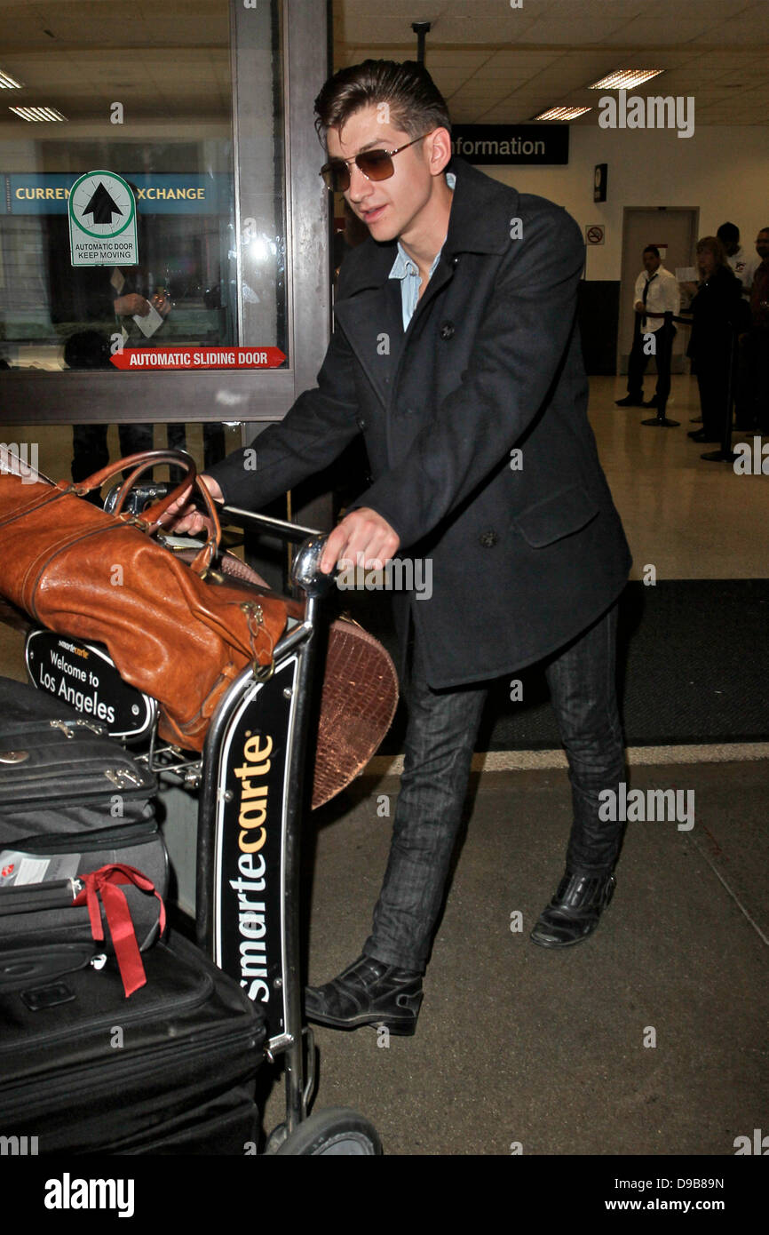 Arctic Monkeys frontman Alex Turner comes through the arrivals hall at ...