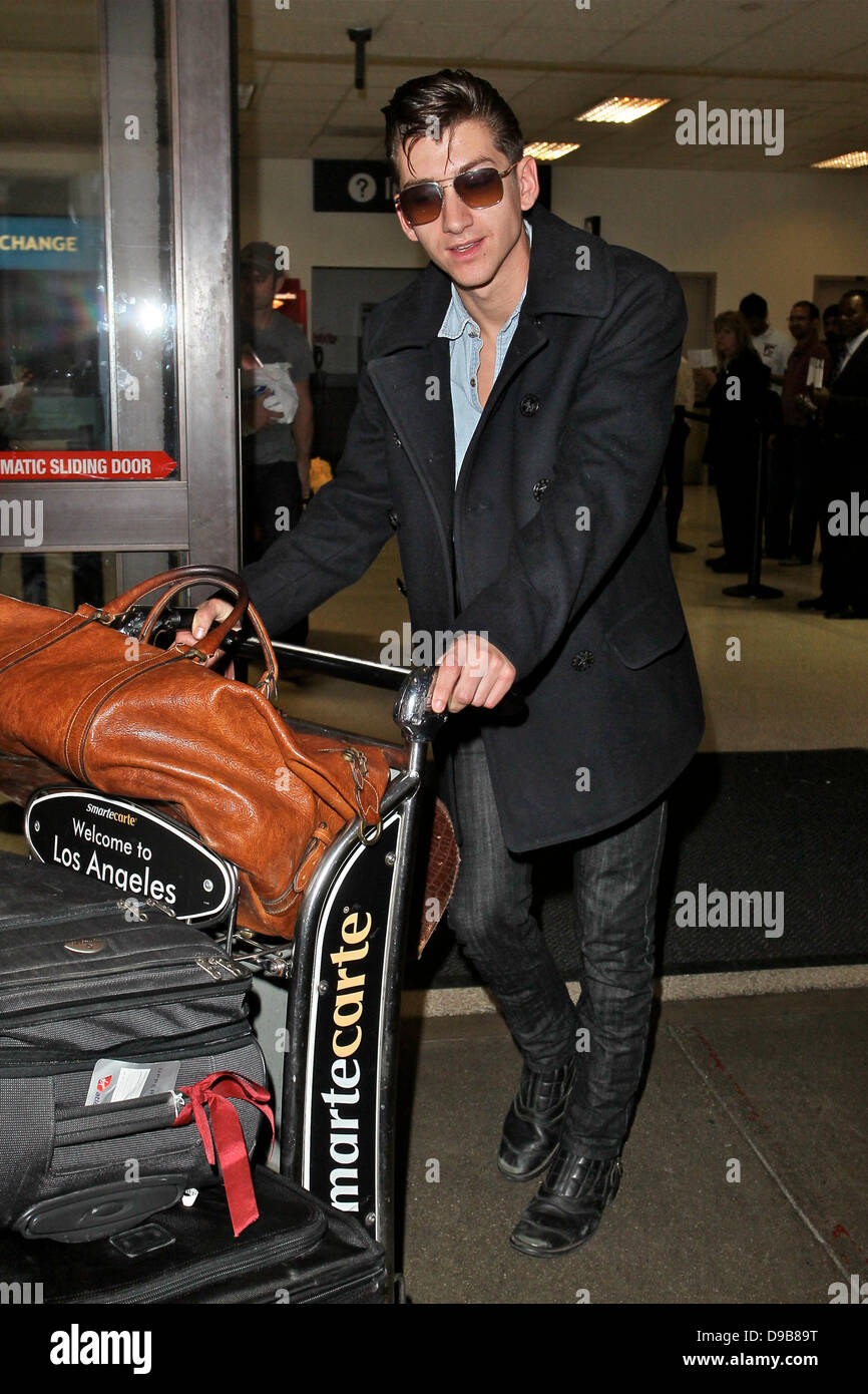Arctic Monkeys frontman Alex Turner comes through the arrivals hall at ...