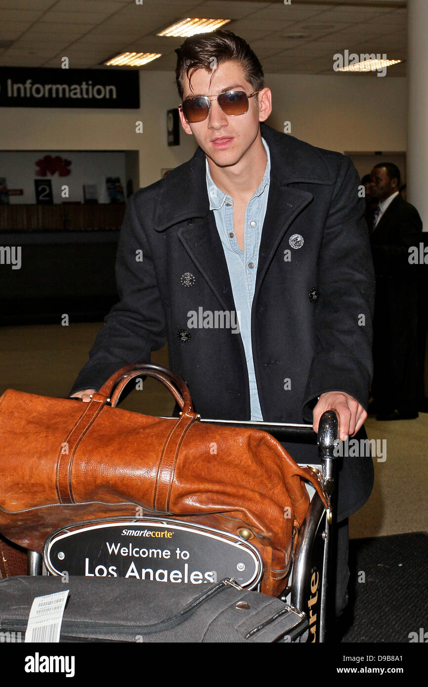 Arctic Monkeys frontman Alex Turner comes through the arrivals hall at ...