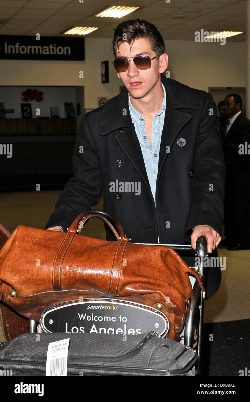 Arctic Monkeys frontman Alex Turner comes through the arrivals hall at ...