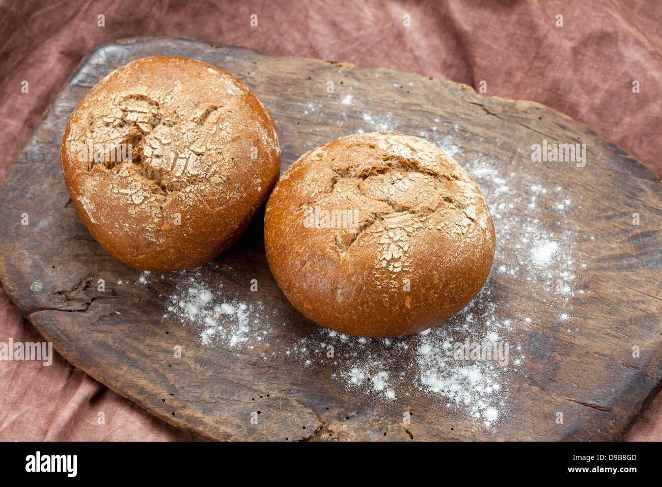 Rye roll on chopping board hi-res stock photography and images - Alamy
