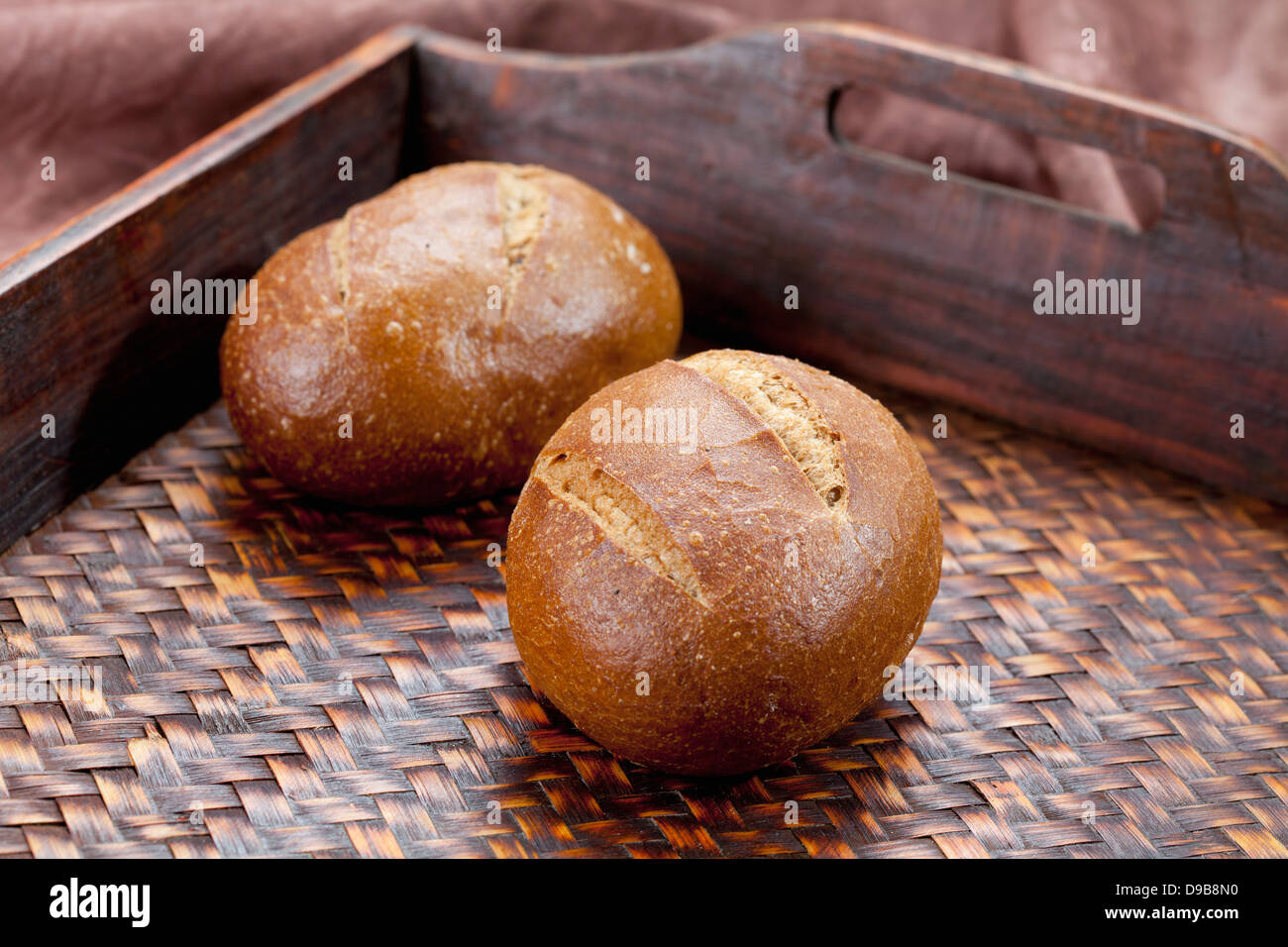 Rye rolls in tray Stock Photo - Alamy