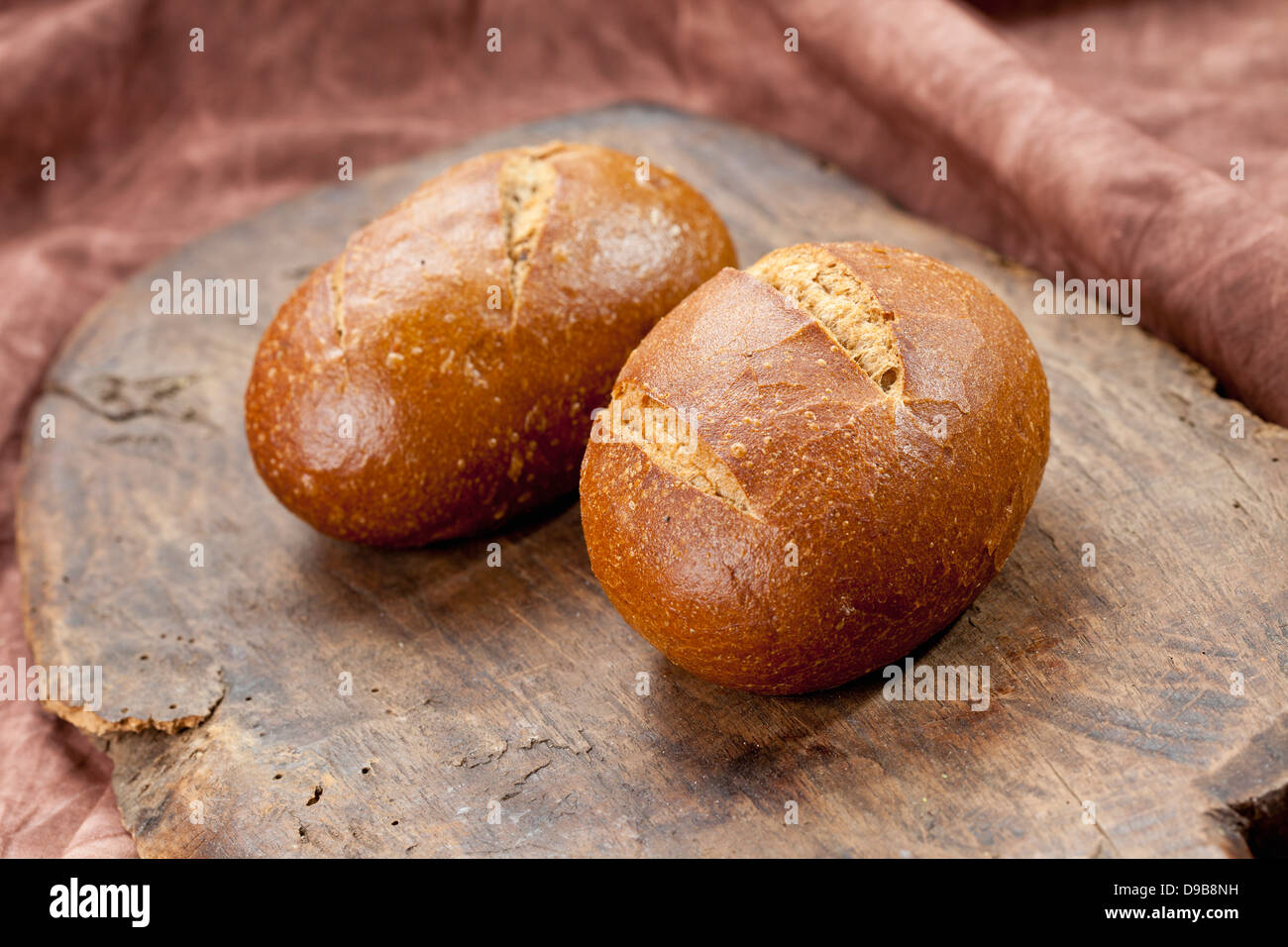 Rye rolls on chopping board hi-res stock photography and images - Alamy